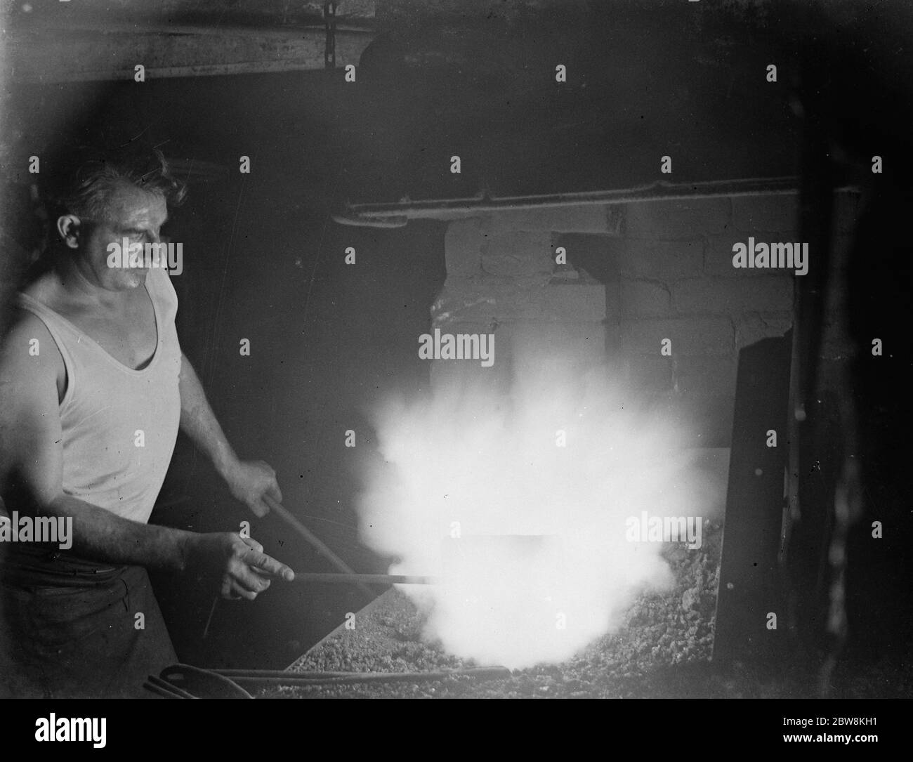 Doug Holland . Working at a forge . 1935 Stock Photo - Alamy