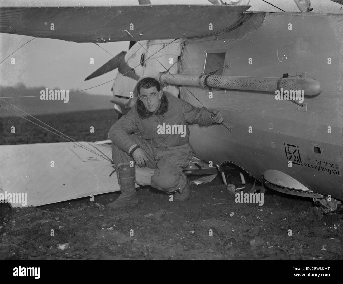 Mr J F Carrols RAF poses next to the cockpit of his , Hawker Hart ...