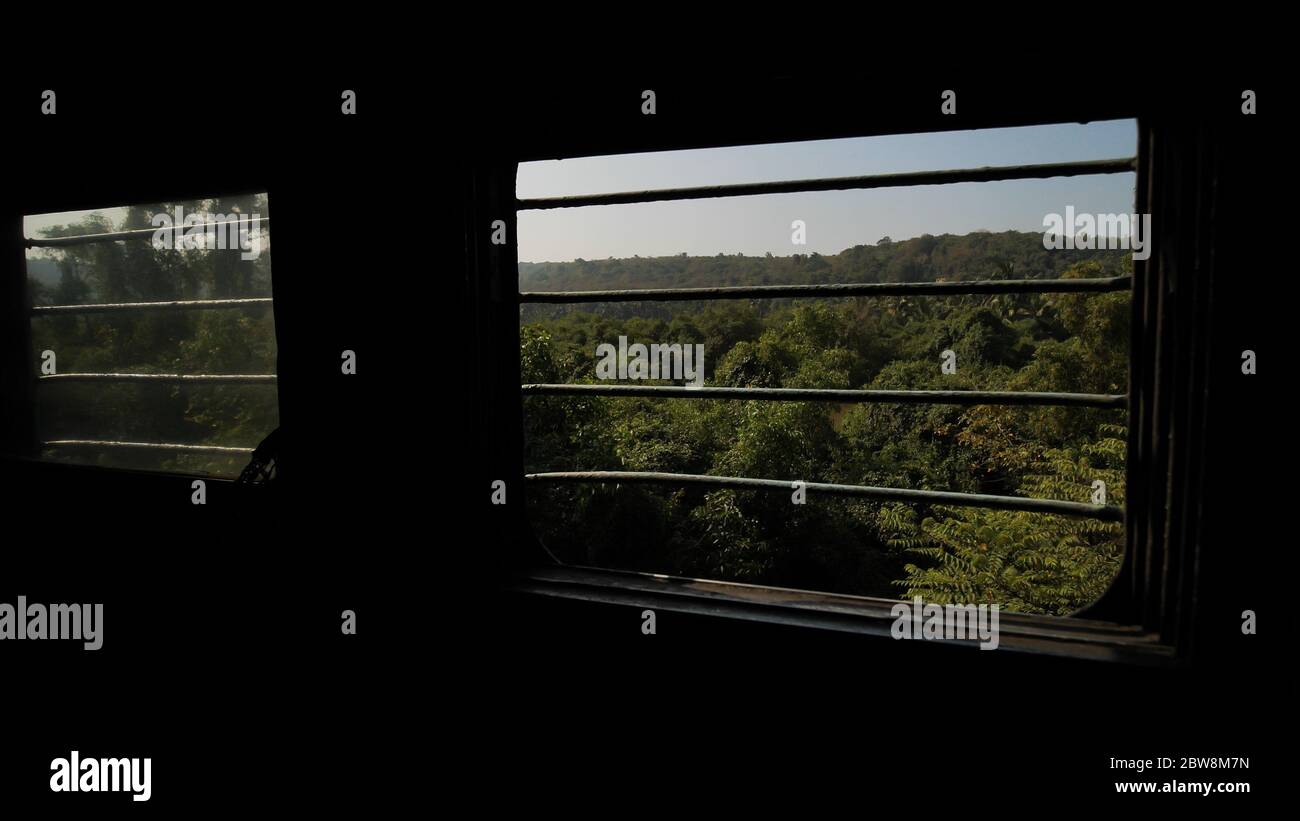 Windows with bars of an indian train Stock Photo - Alamy