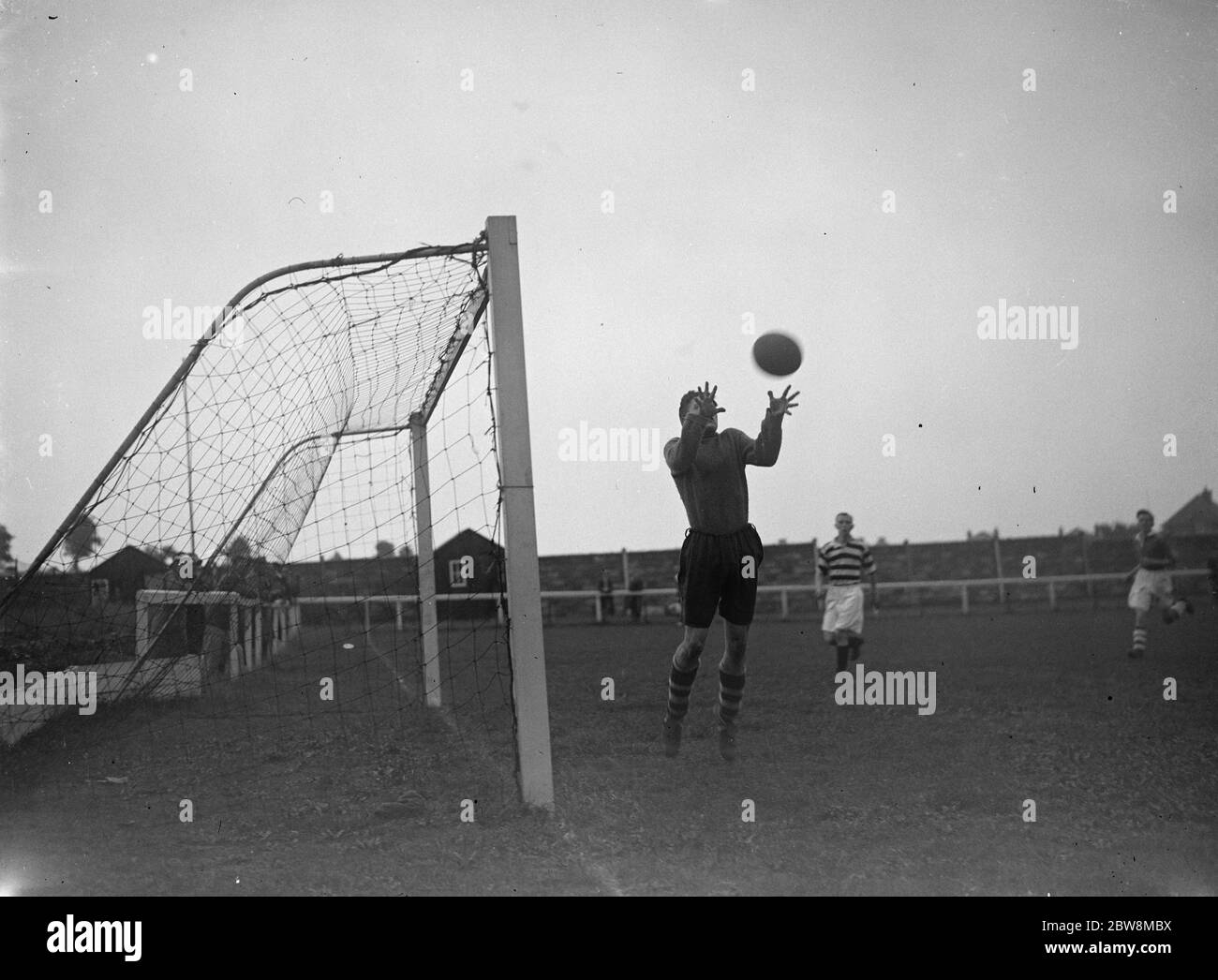 Football match. Goalkeeper making a save . 1935 Stock Photo - Alamy
