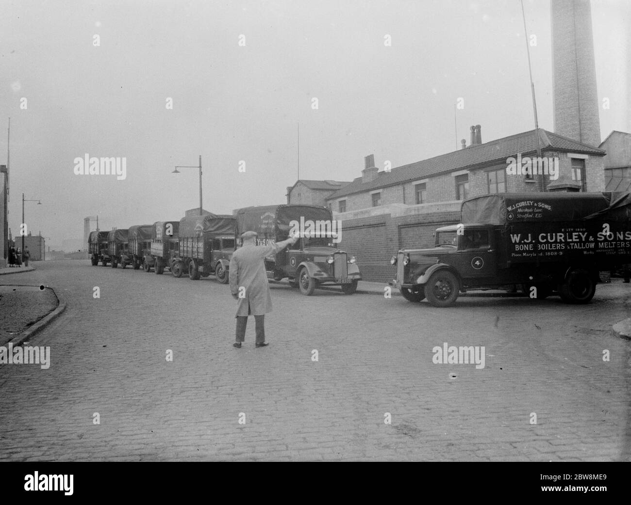 A fleet of lorries belonging to WJ Curley ' s bone factory , Marshgate ...