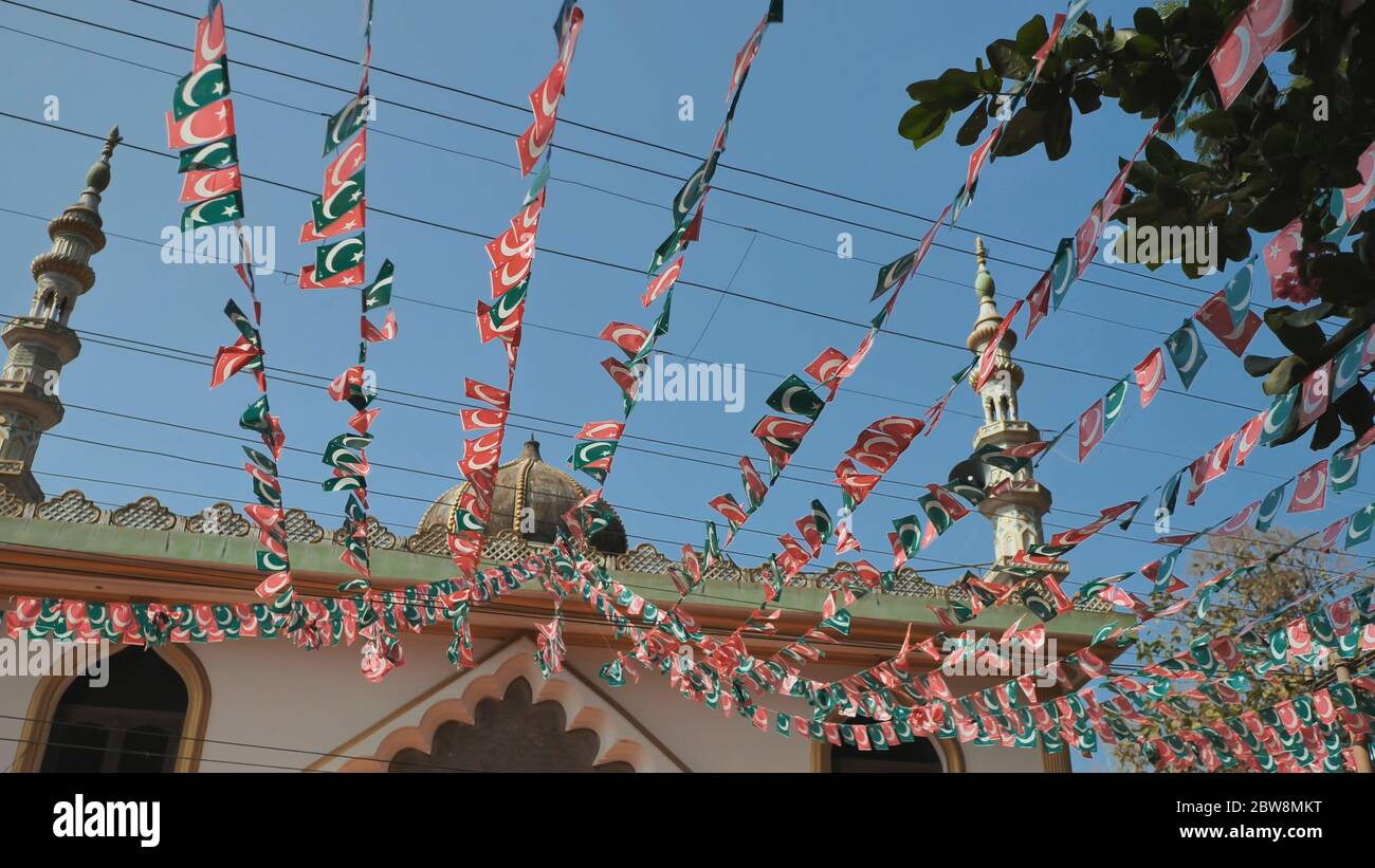 Small flags of the Indian Union Muslim League are hung over the streets ...
