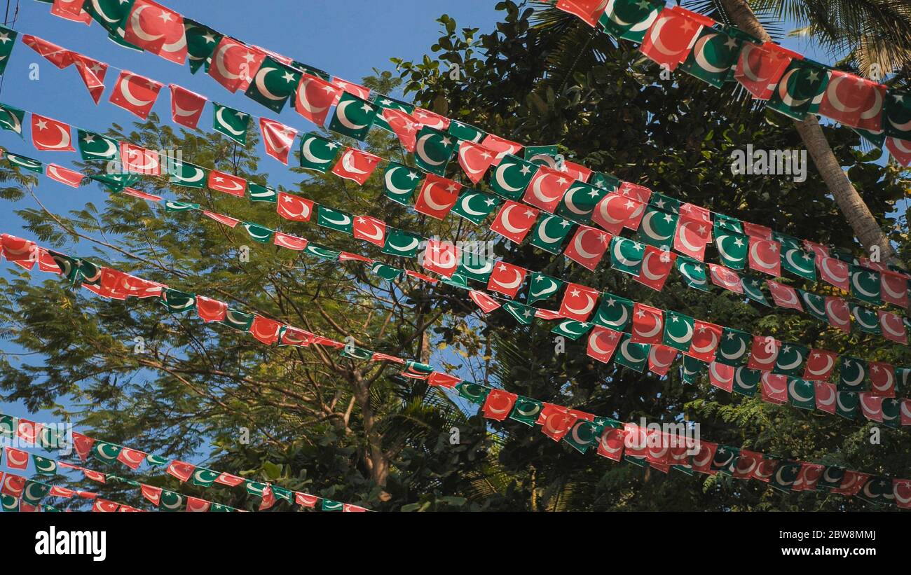 Small flags of the Indian Union Muslim League are hung over the streets ...