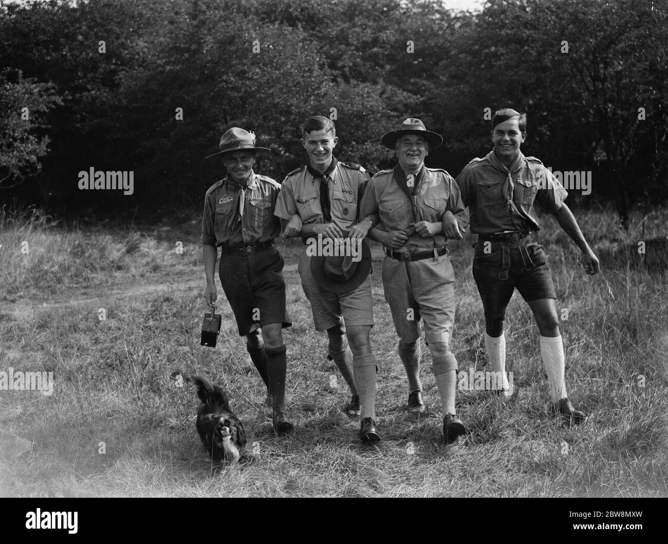 Mr Spencer and scouts and pet dog . 1935 Stock Photo - Alamy