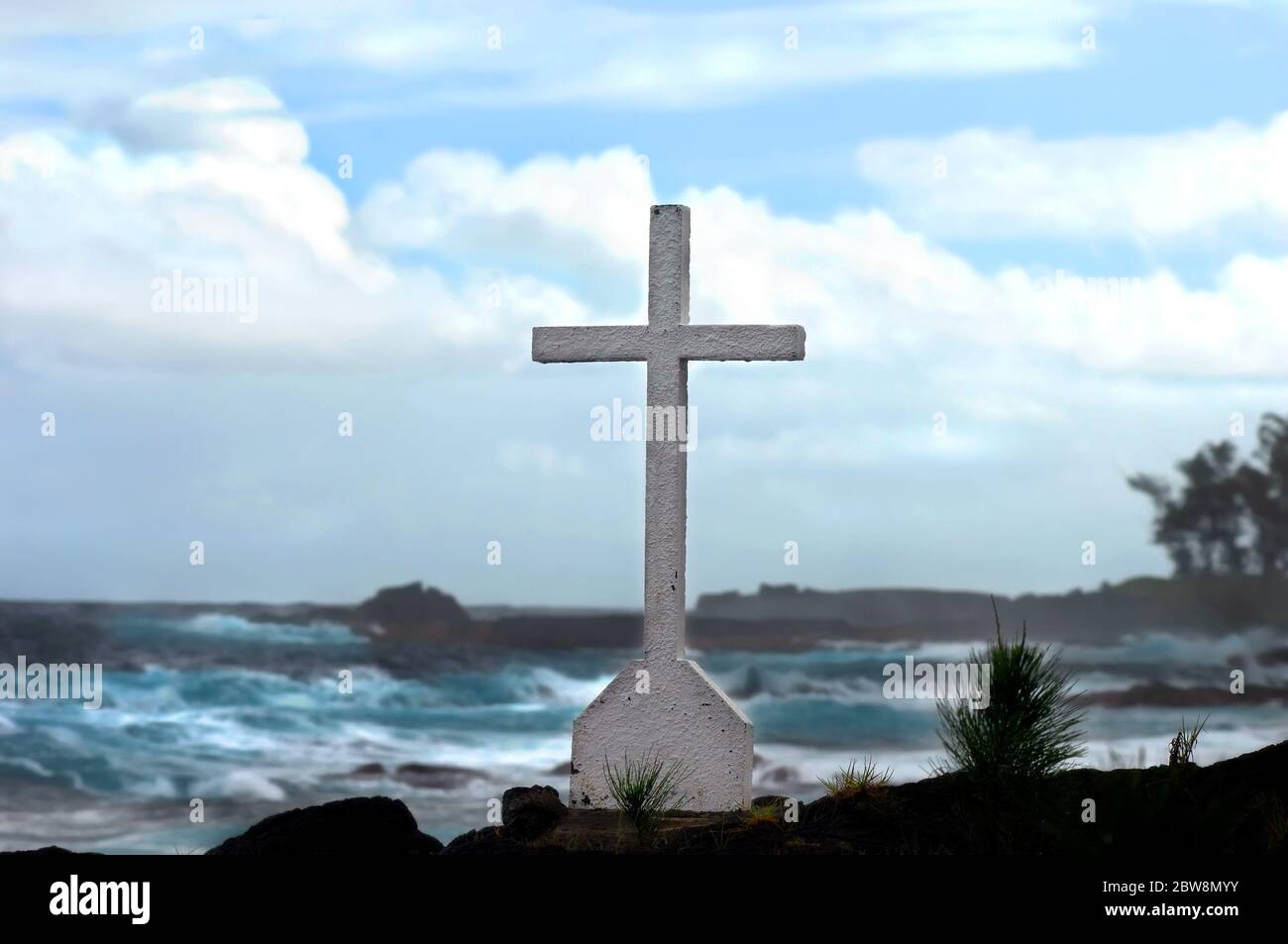 Big Island of Hawaii has a rugged windward side. Lone cross sits on the ...