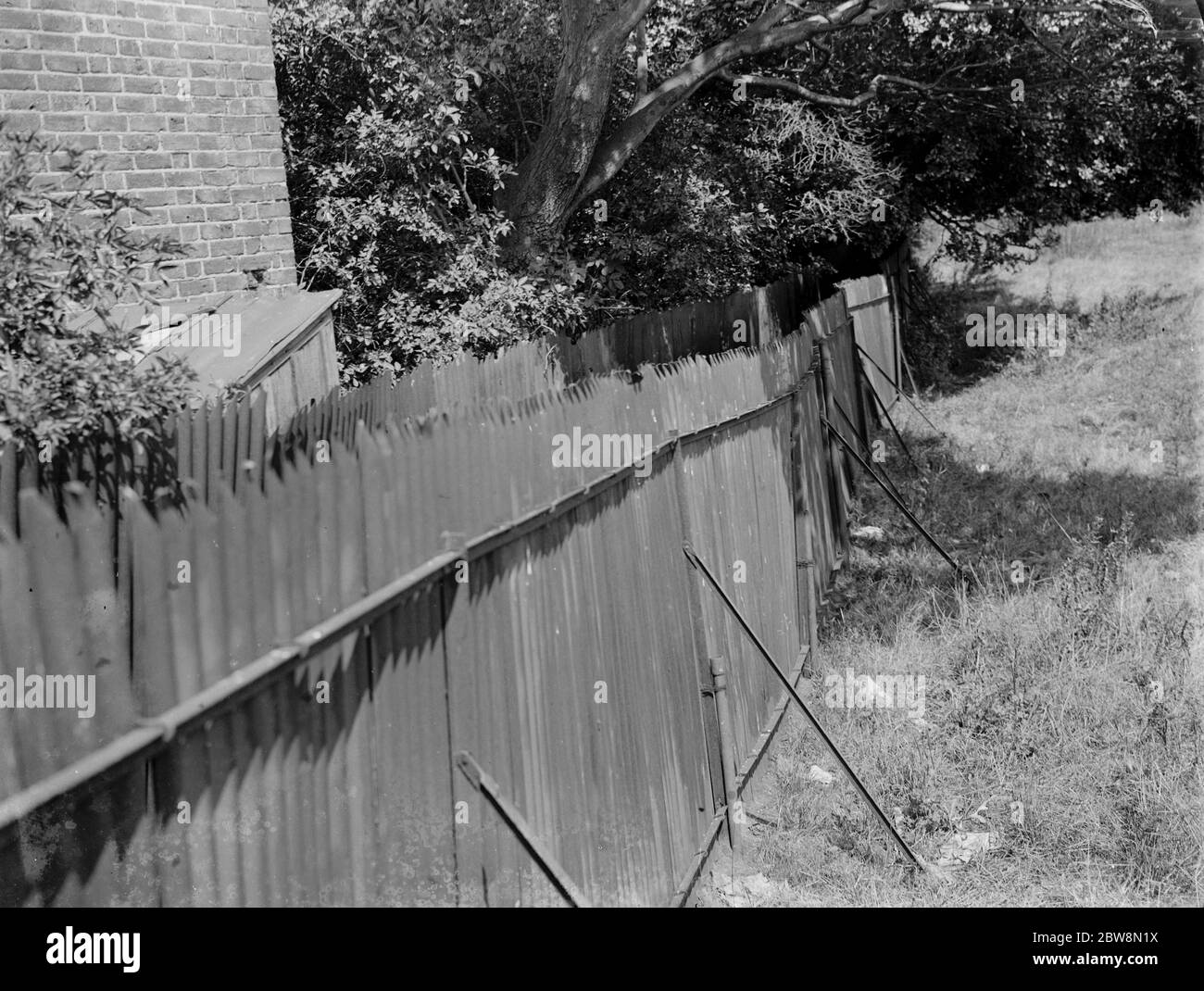 Corrugated iron fence at Darenth , Kent . 1935 Stock Photo - Alamy