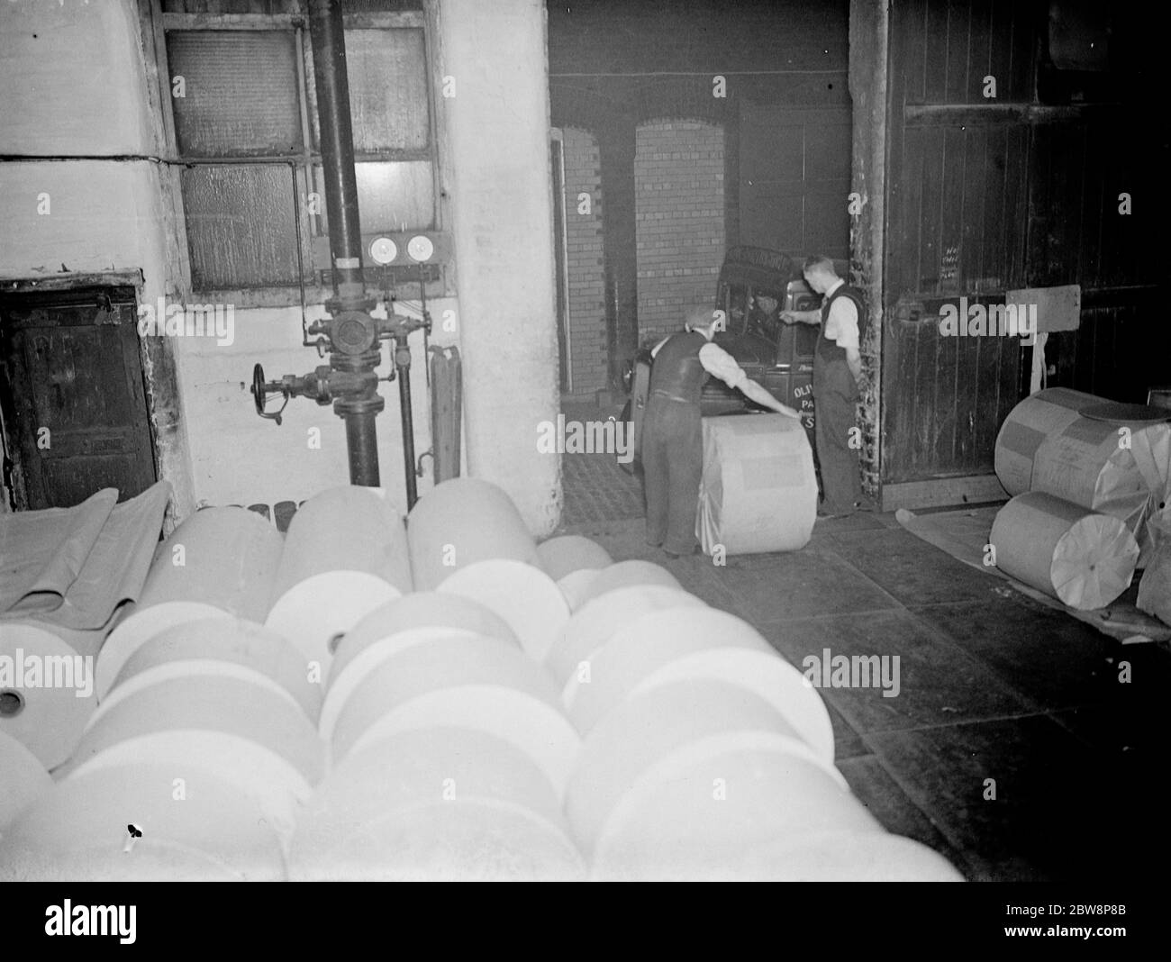 Olive and Partington Paper Mill ., Manchester . Rolling the load to the ...