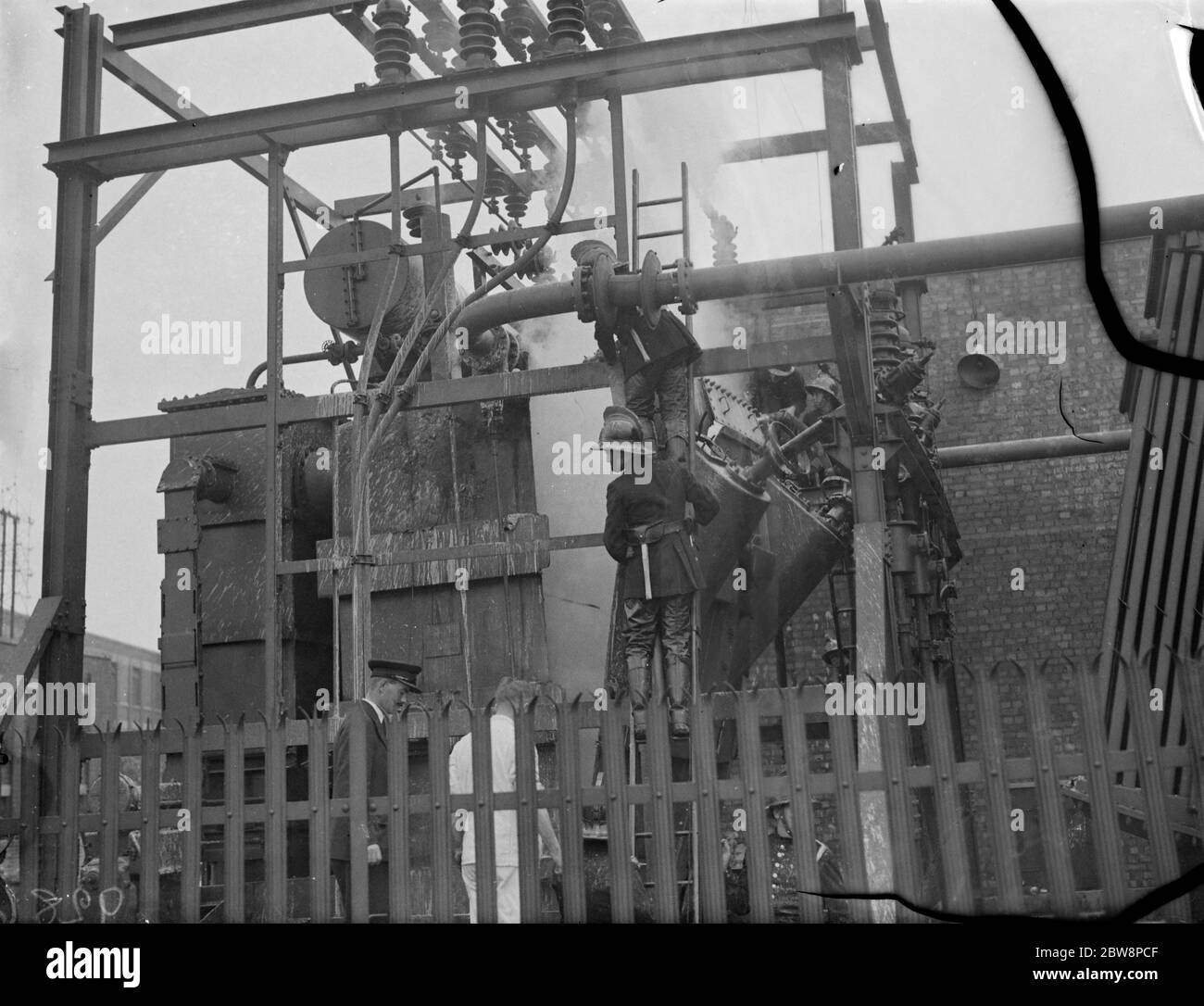 Fireman working on grid transformer after the Deptford power station ...
