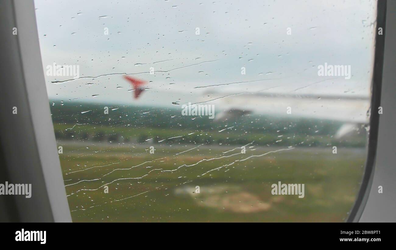 Take off the plane in bad rainy weather Stock Photo - Alamy