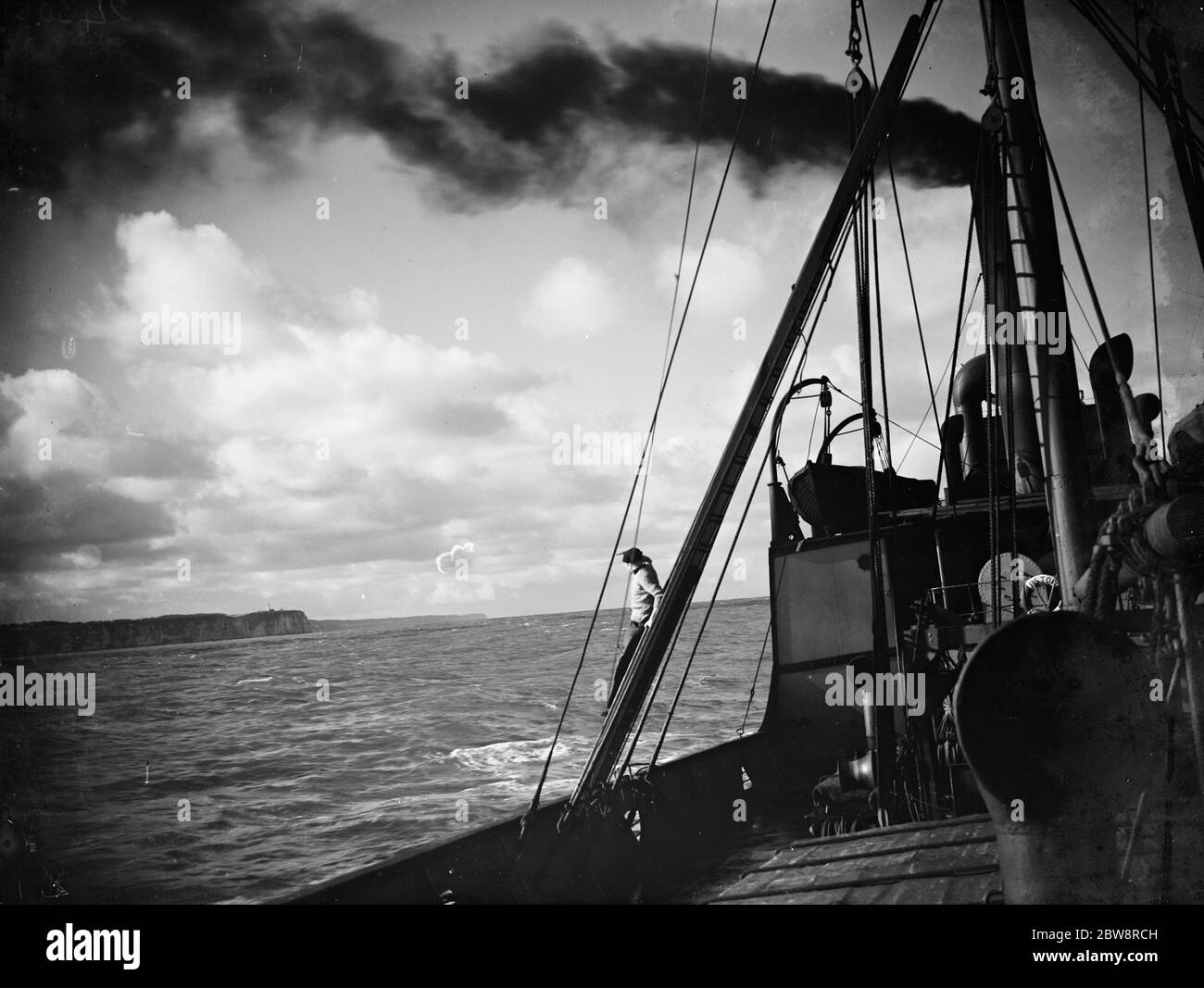 The coast of France in sight from the deck of the tramp steamer ...
