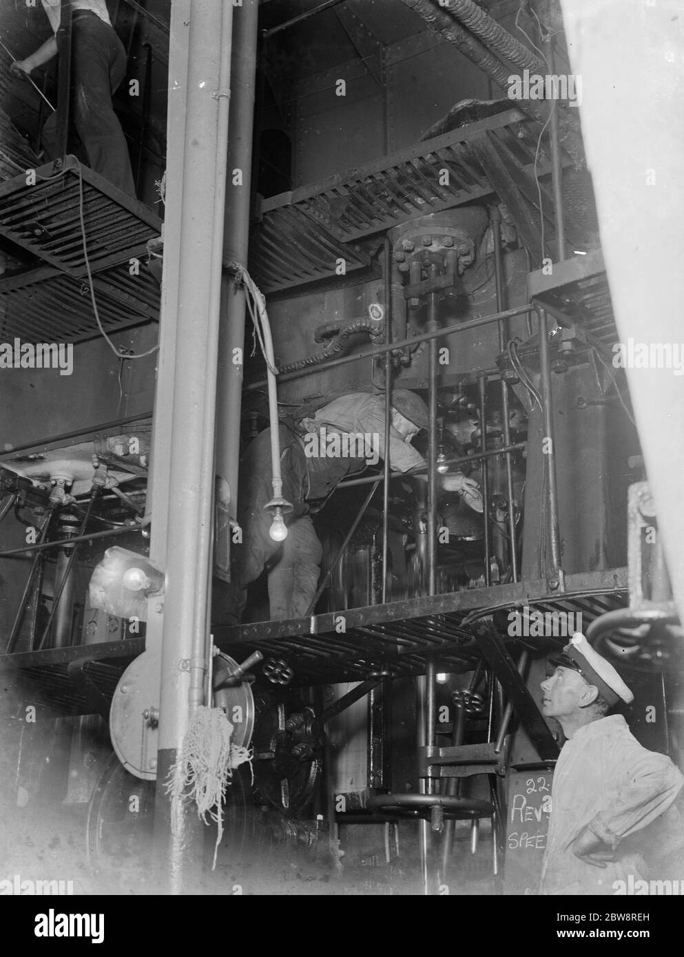 The engineers in the engine room of the tramp steamer th ' SS Eston ...