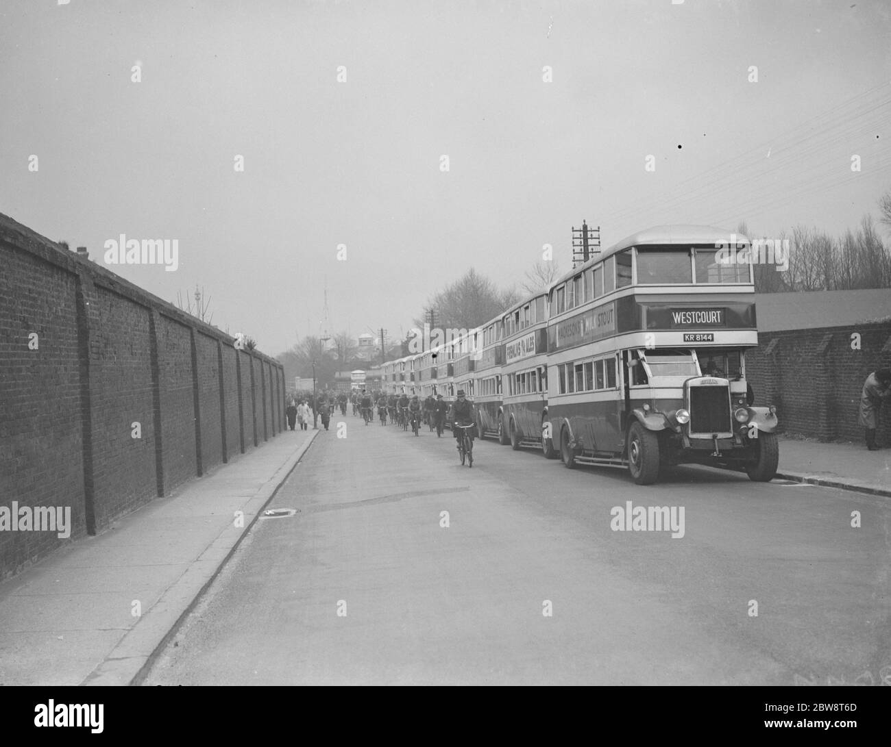 Buses parked on the road outside Chatham dockyard . Dock workers ...