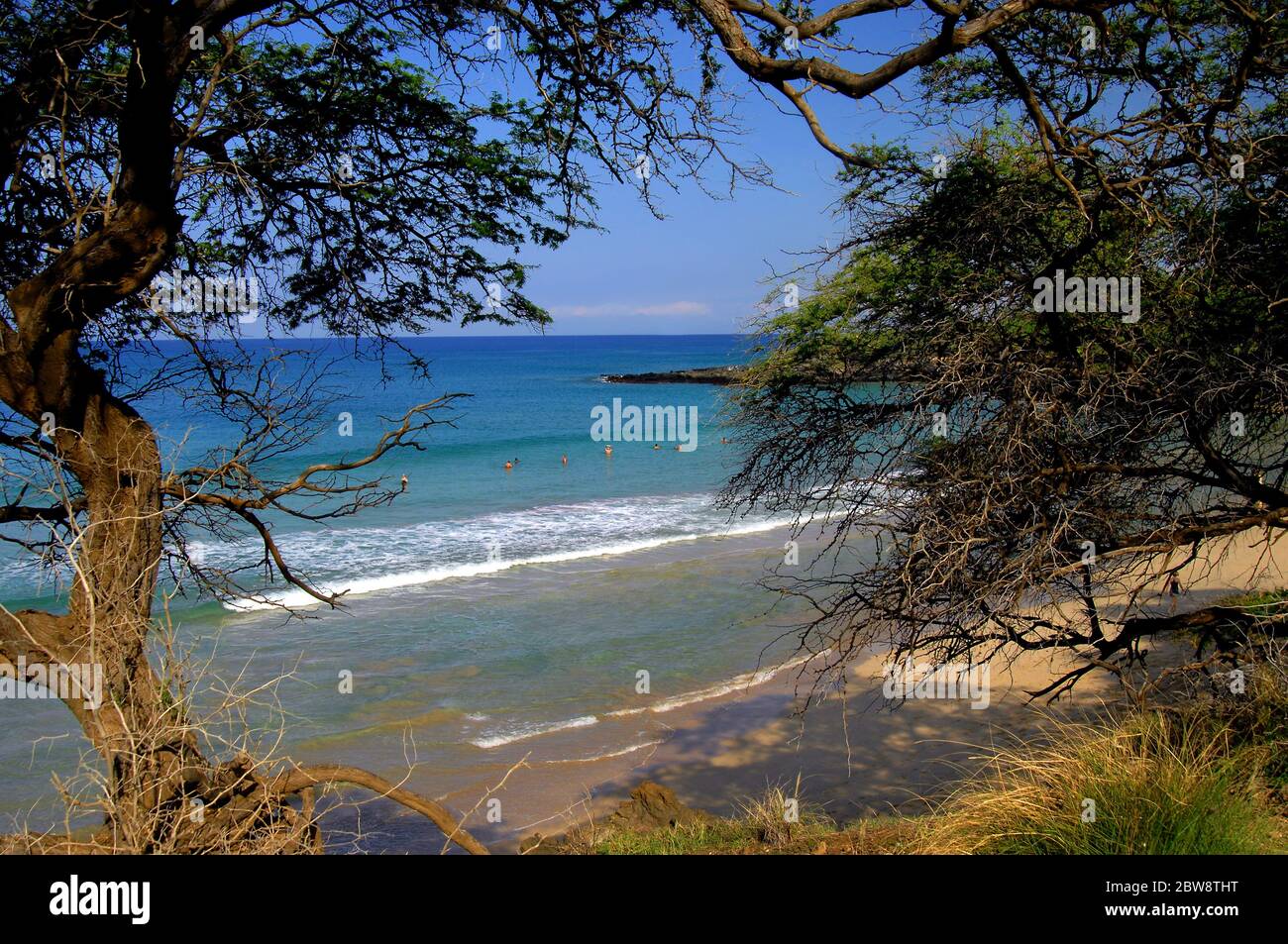 Swimmers enjoy the gentle water and sloping beaches of the Kohala Coast ...