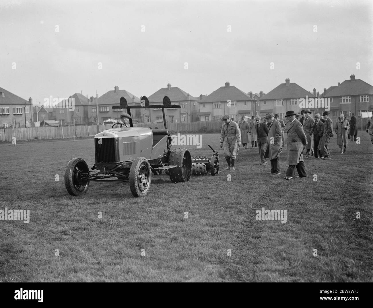 The Pattisson tractor demonstration . A tractor with a lawn reviver ...