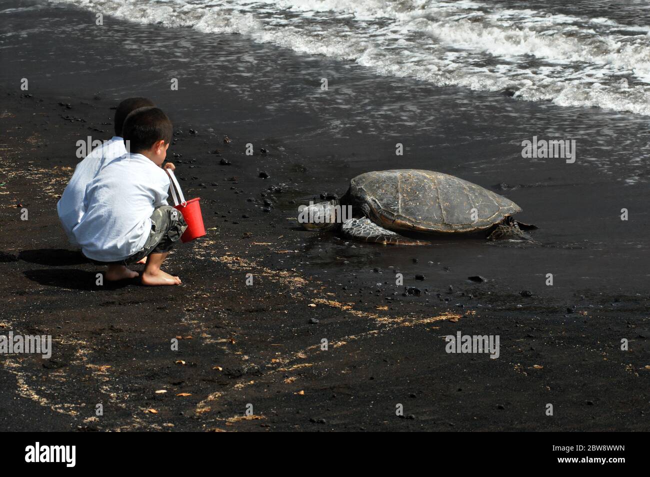 Two children kneel hi-res stock photography and images - Alamy