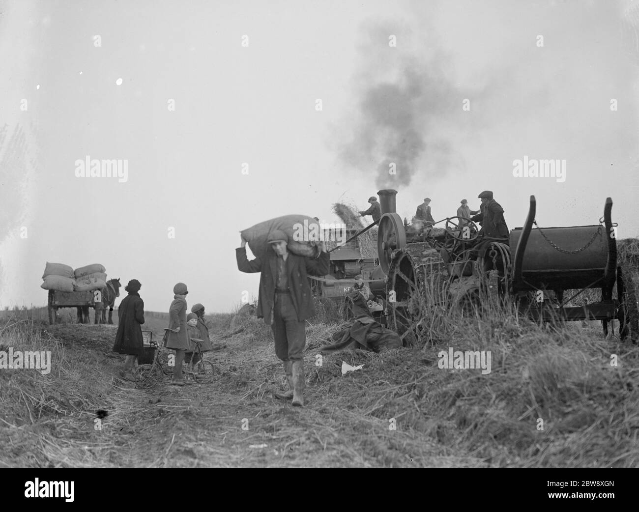 A farming scene . Farm workers in Farningham at work using a steam ...