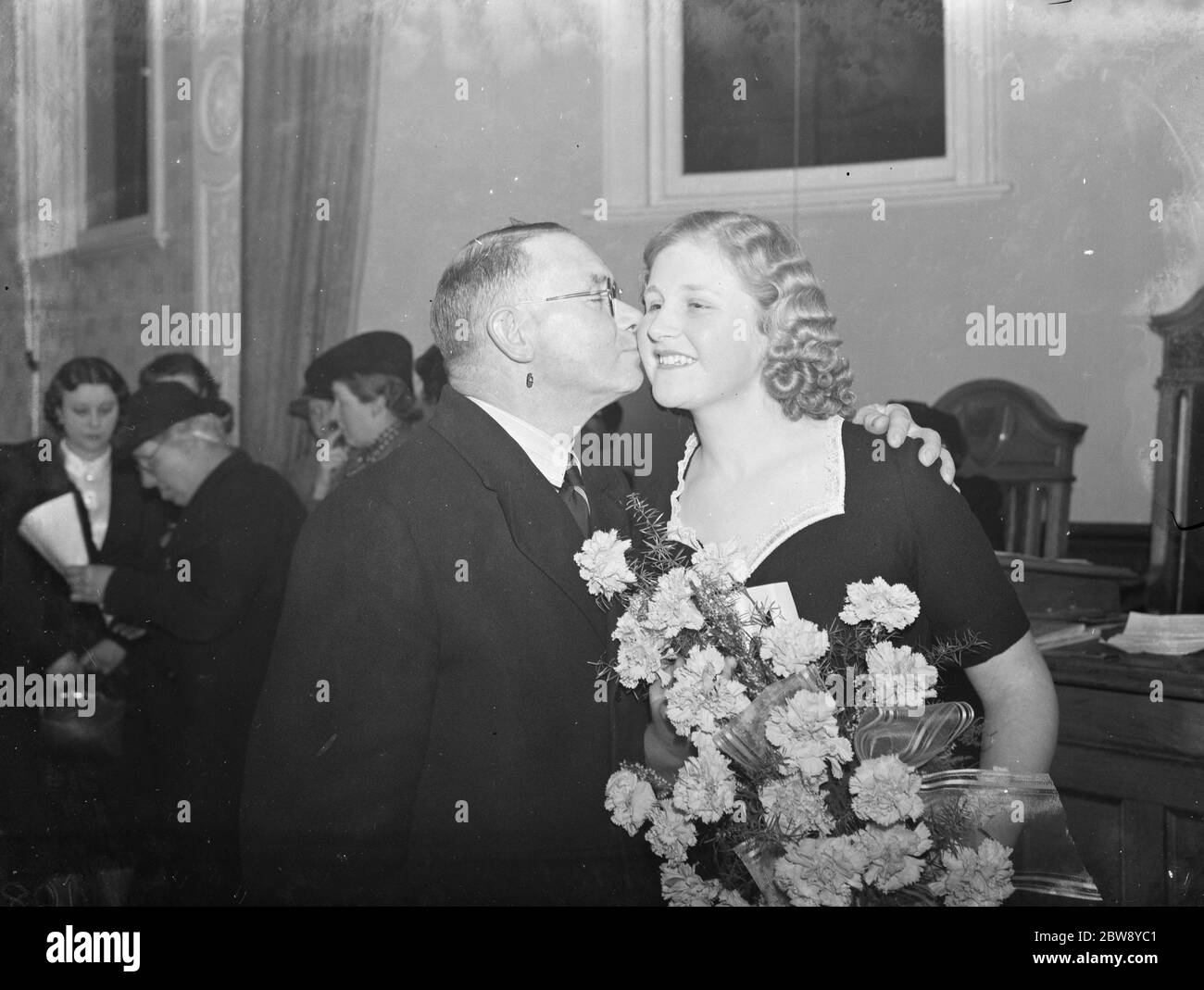 The Dartford Carnival Queen Miss Joan Tompkins receiving a kiss from ...