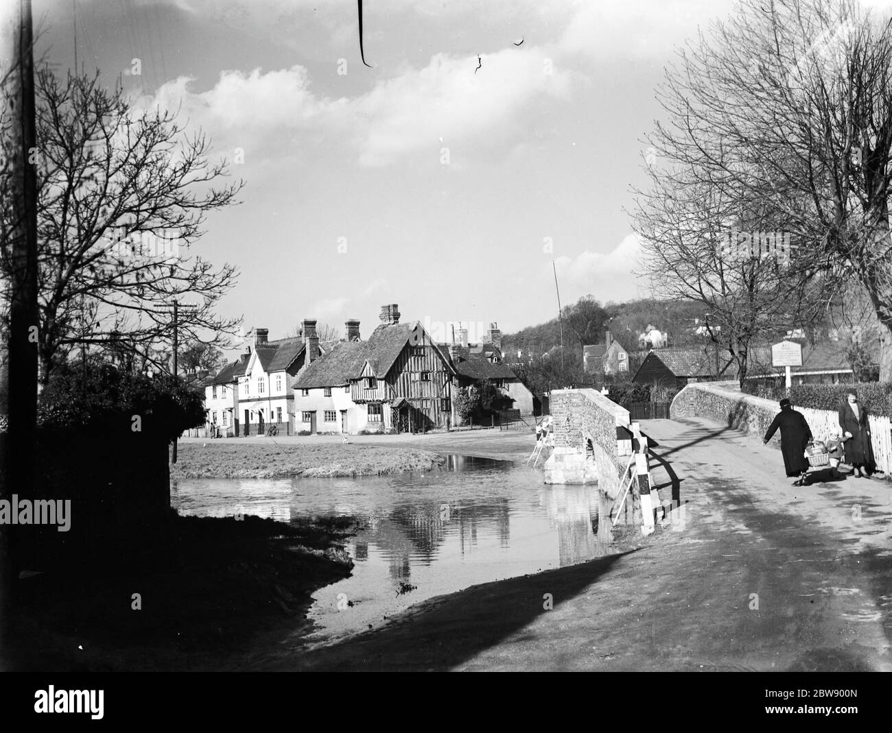 A view of Eynsford over the River Darent by the bridge and ford . 1936 ...