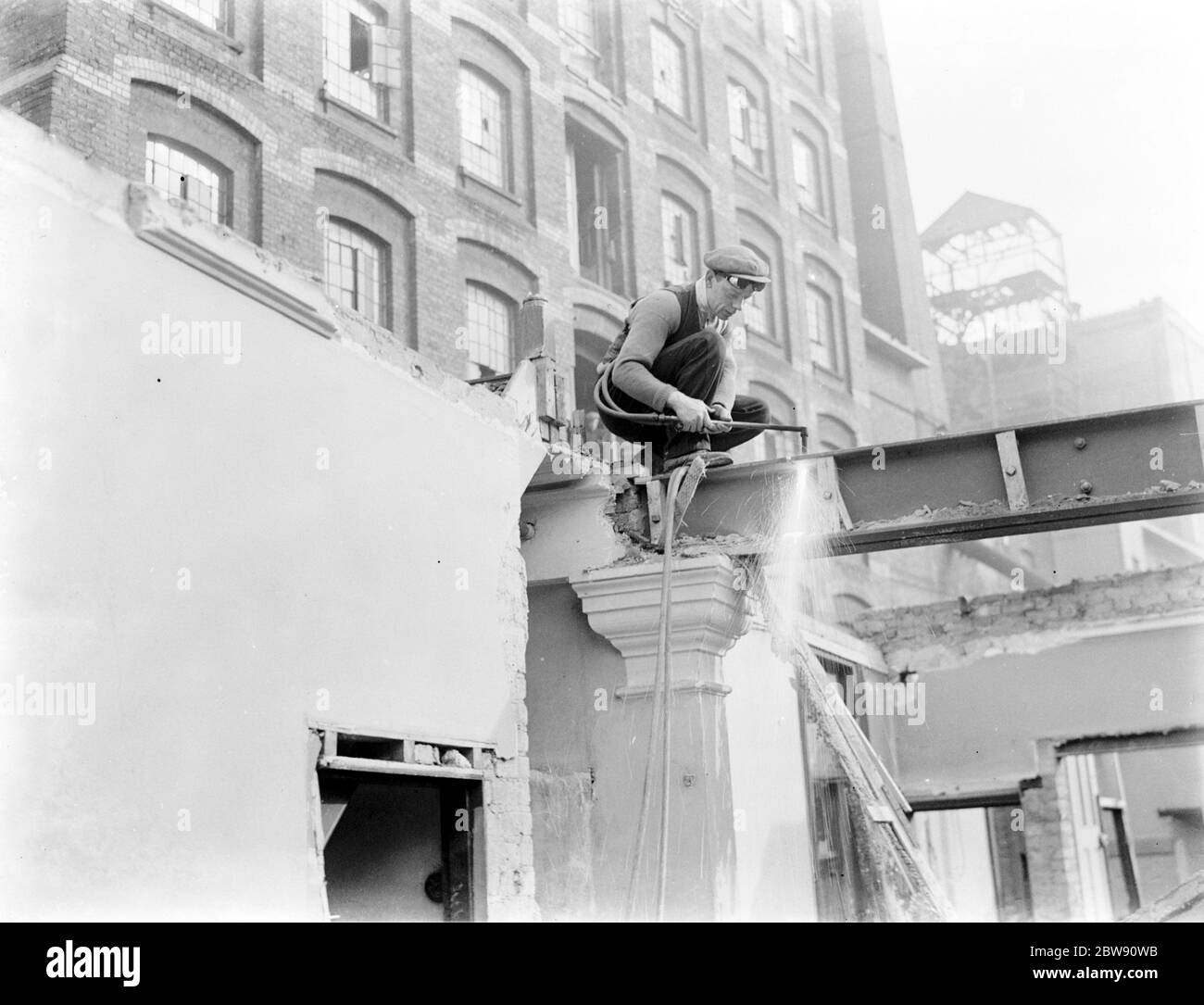 The redevelopment of the Erith riverside , London . A welder with a ...