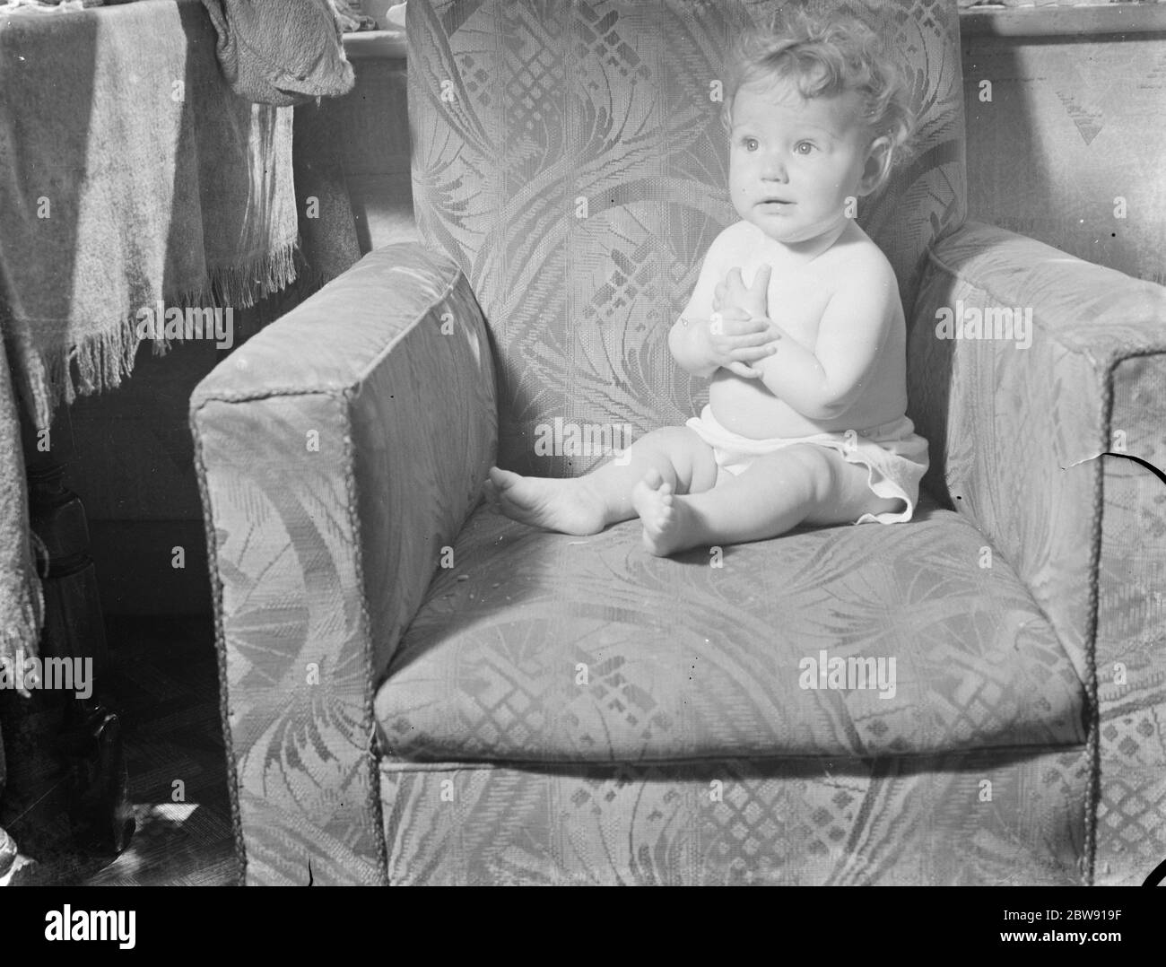 Baby Lee in an armchair 1939 Stock Photo - Alamy