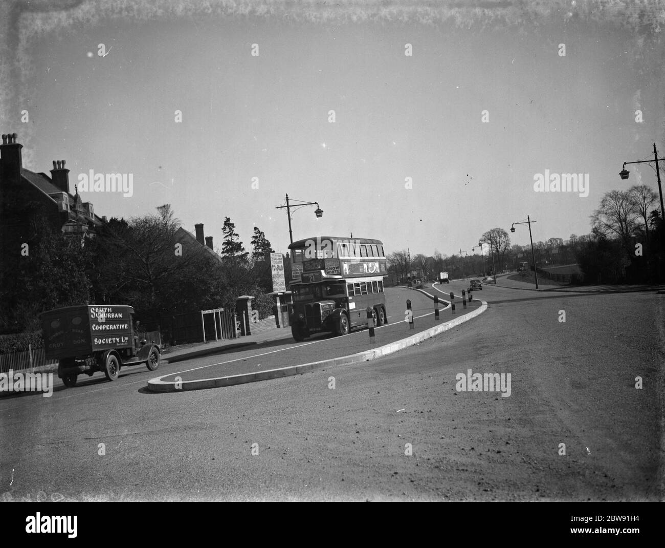 A bus driving around a road island on the Sidcup bypass . 1938 Stock ...