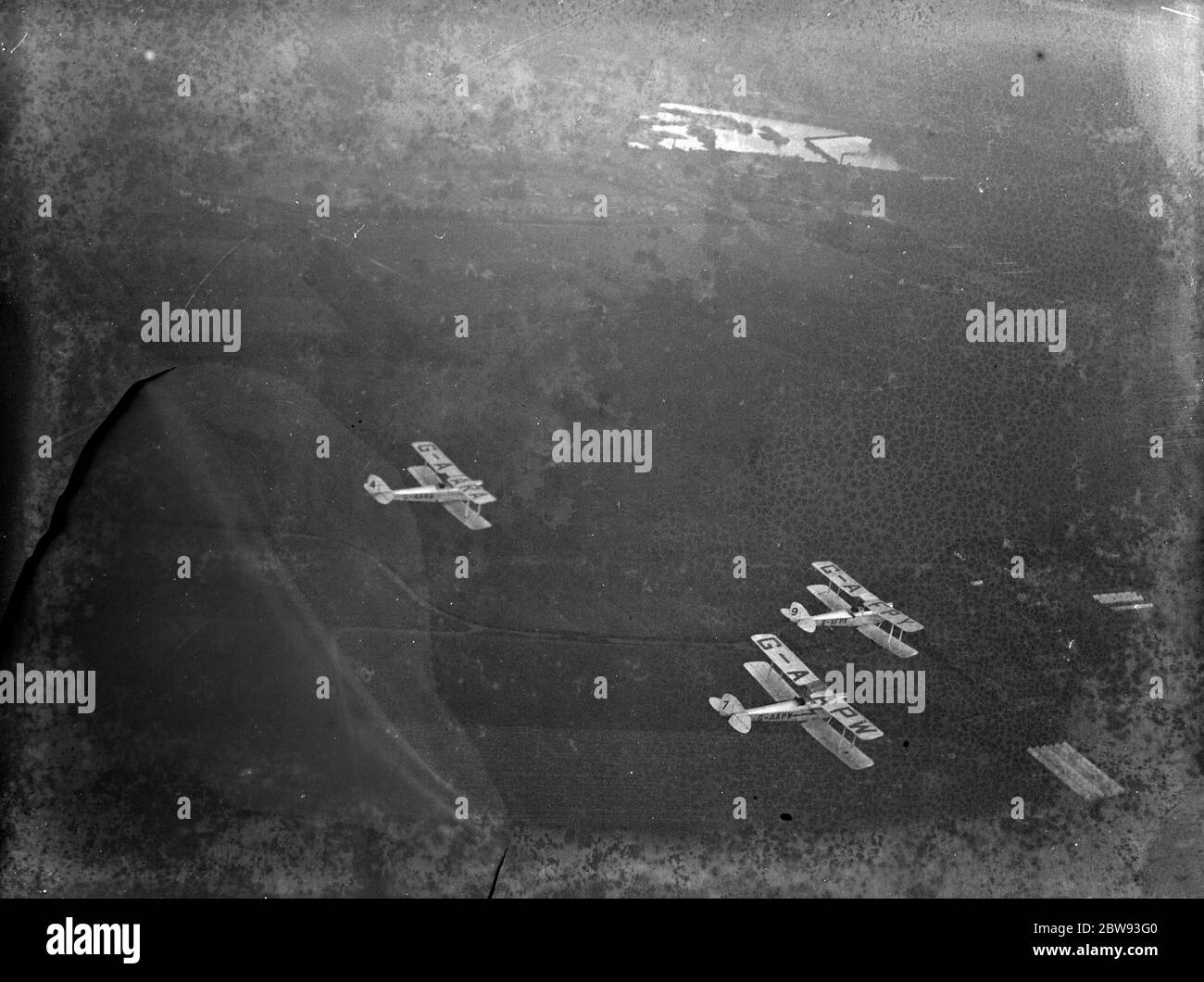Three De Havilland DH60X moths ( G-AAPW , G-AARA , G-AFPY ) performing ...