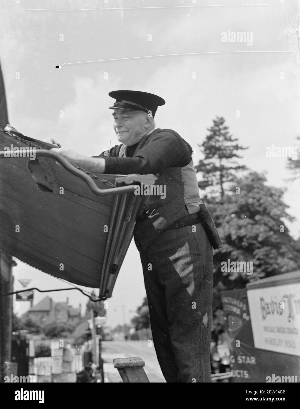 Mr James Parnell , an ex sailor , repairs a shop blind . 22 June 1937 ...