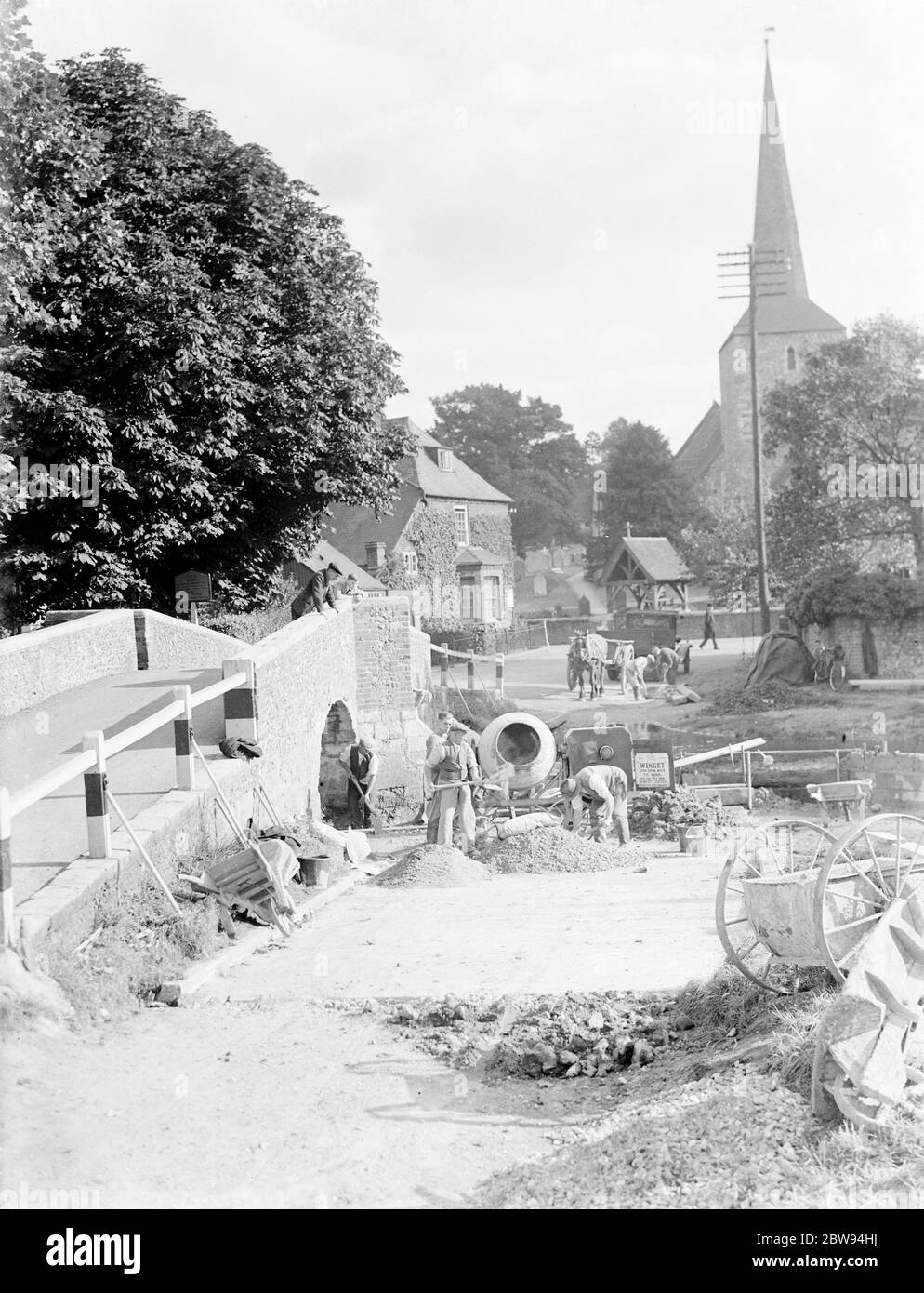 Workers building a ford water crossing by the Eynsford bridge over the ...