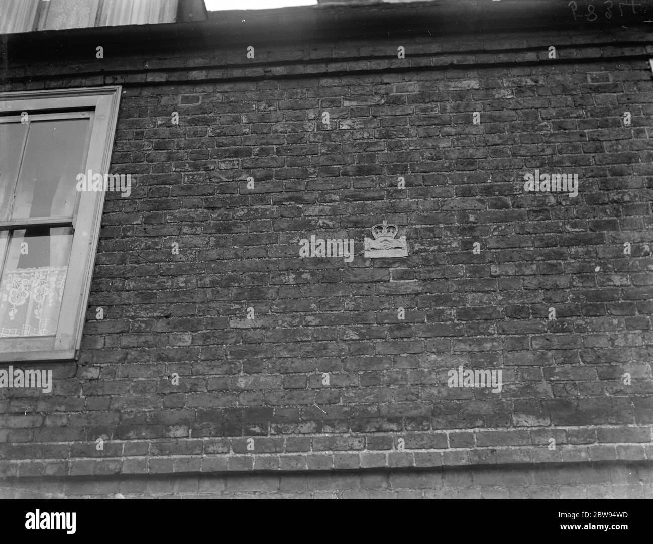 A fire plaque on a building . 1937 Stock Photo - Alamy