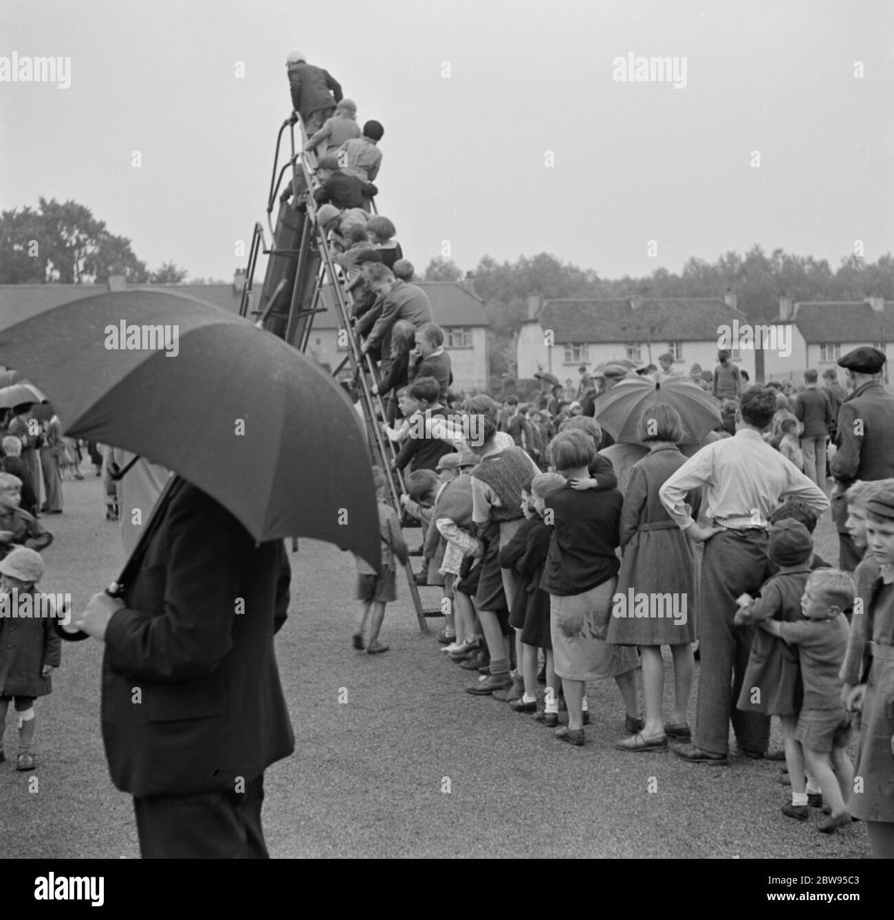 Children cueing up for the slide at the children 's playground in ...
