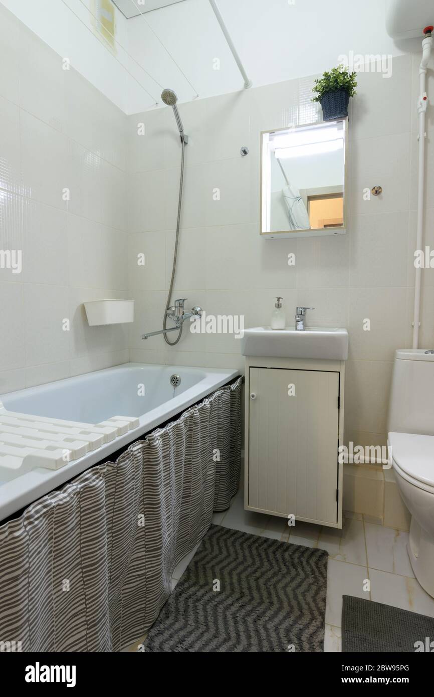 Classic cozy small bathroom with a toilet Stock Photo - Alamy