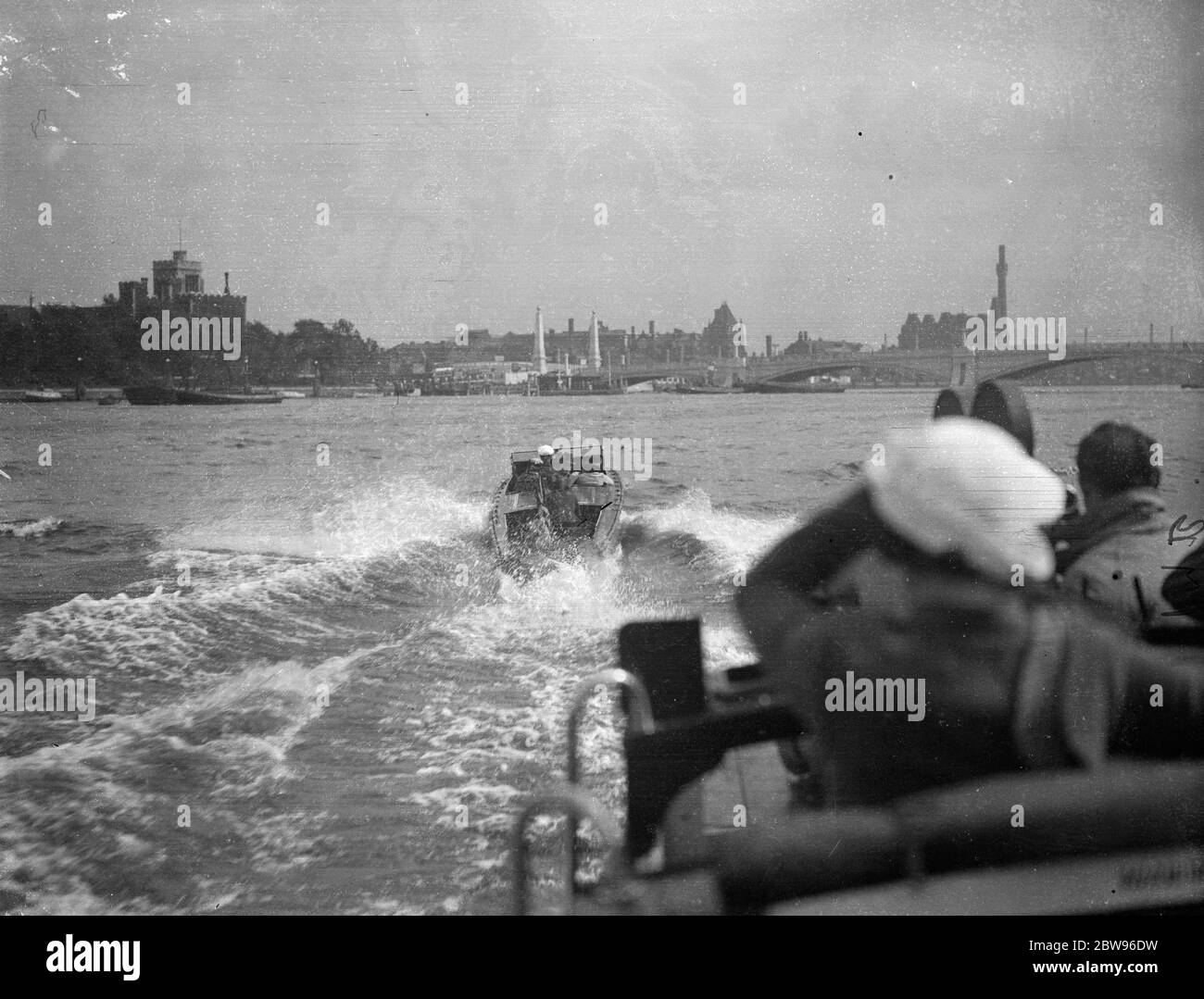 A film thrill on the thames . Crowds of Londoners lining the banks of ...