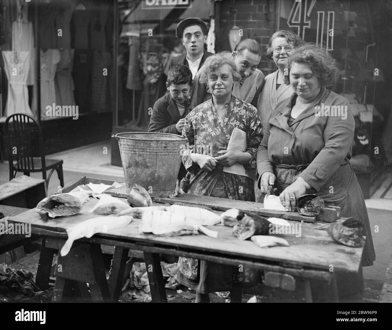 Whitechapel , the Jewish quarter of London . An open air fish shop in ...