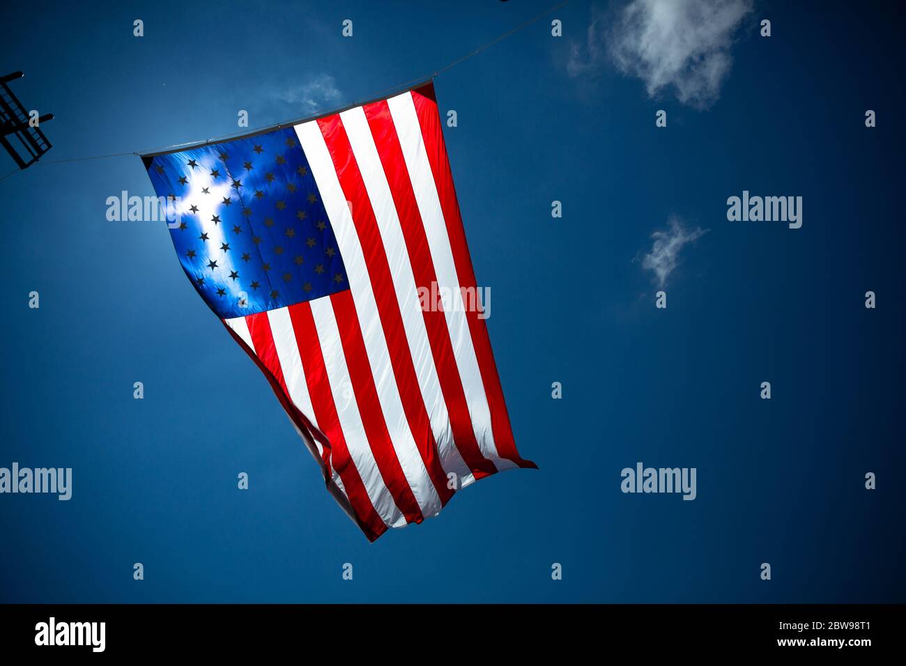 Us flag against a blue sky hi-res stock photography and images - Alamy