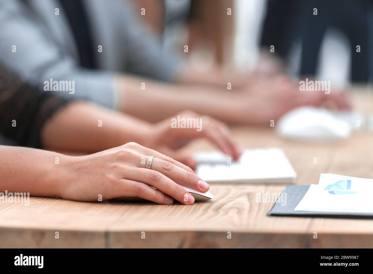 working group using computers to work with financial data Stock Photo ...