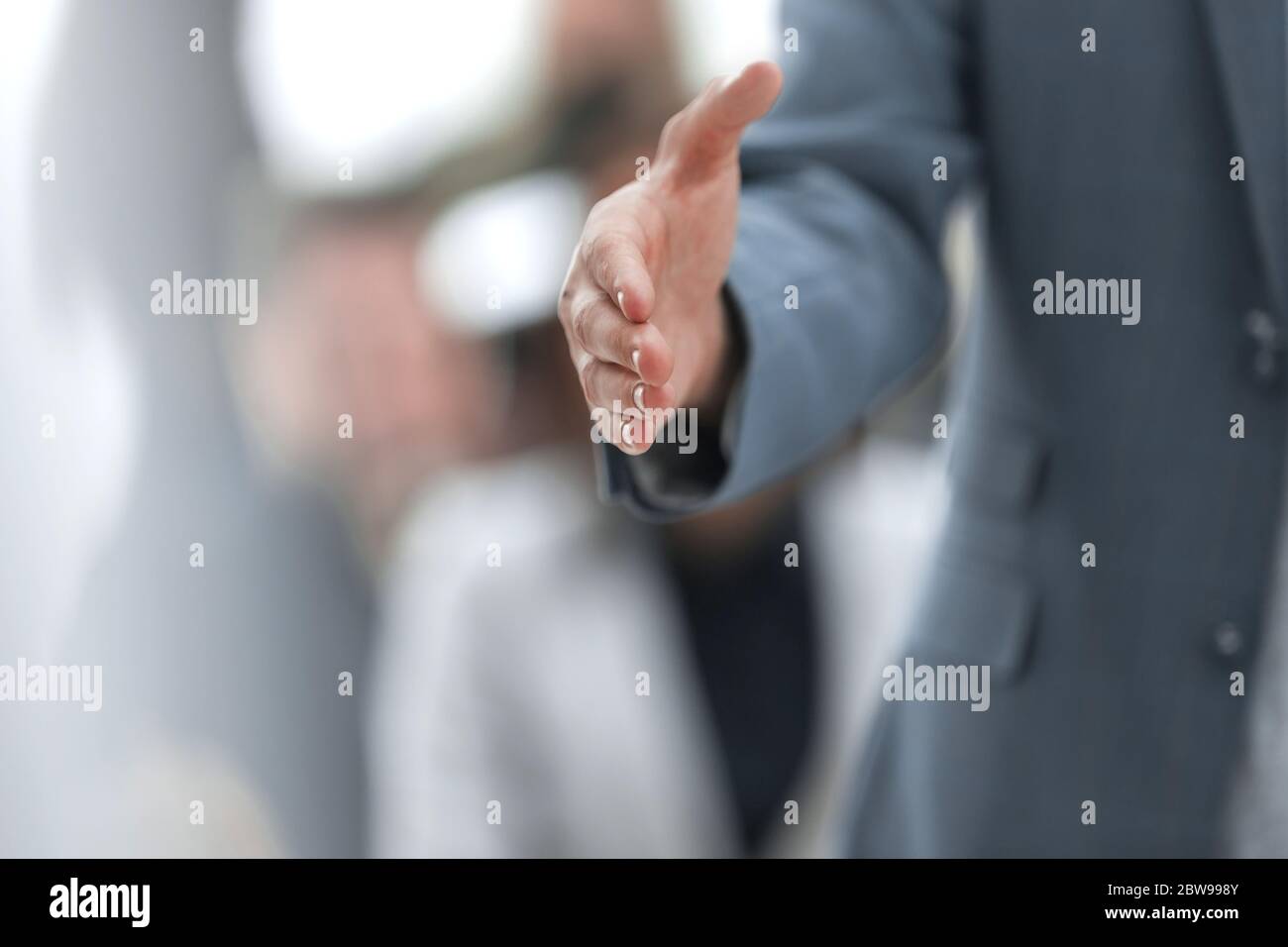 close up. business man holding out his hand for a handshake Stock Photo ...