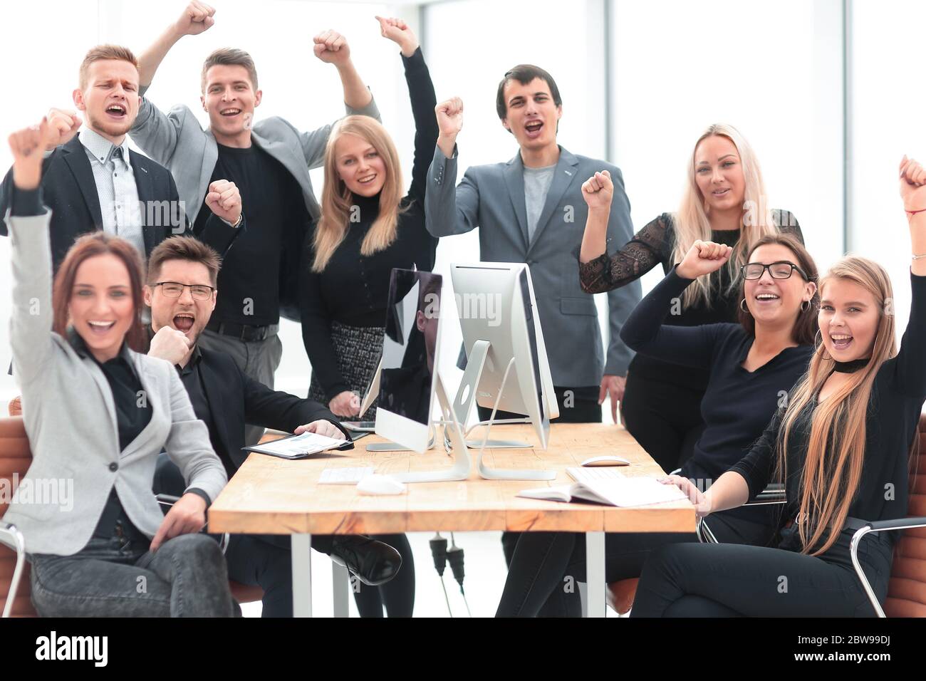 happy business team at the workplace in the office Stock Photo - Alamy