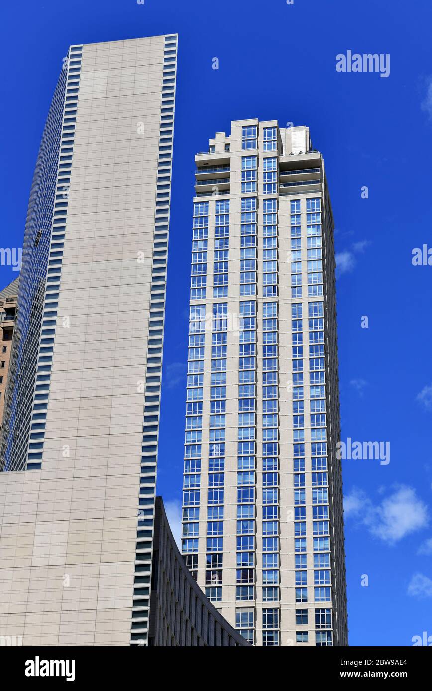 Tall high rise skyscraper with blue sky in Manhattan New York Stock ...