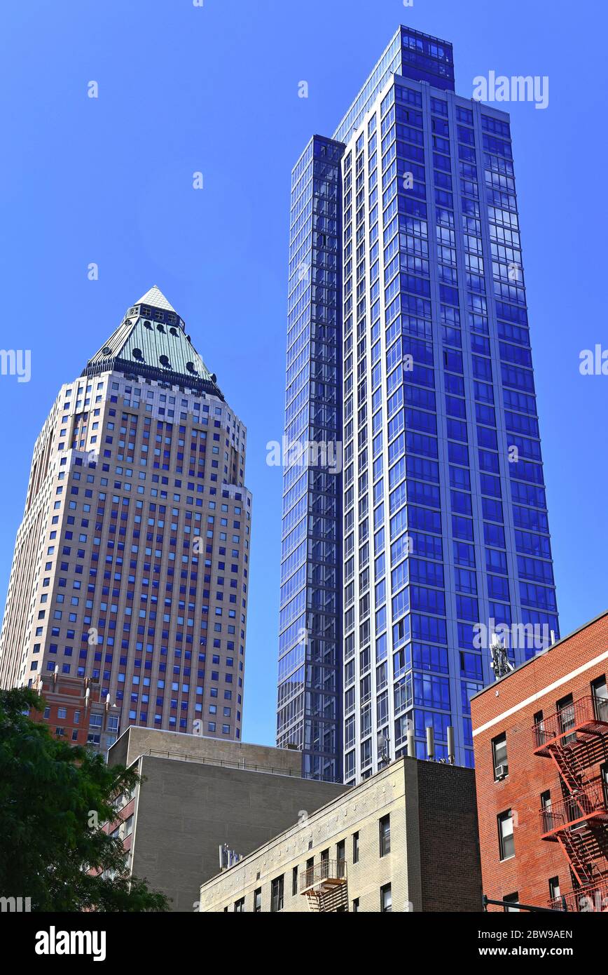 Tall high rise skyscraper with blue sky in Manhattan New York Stock ...