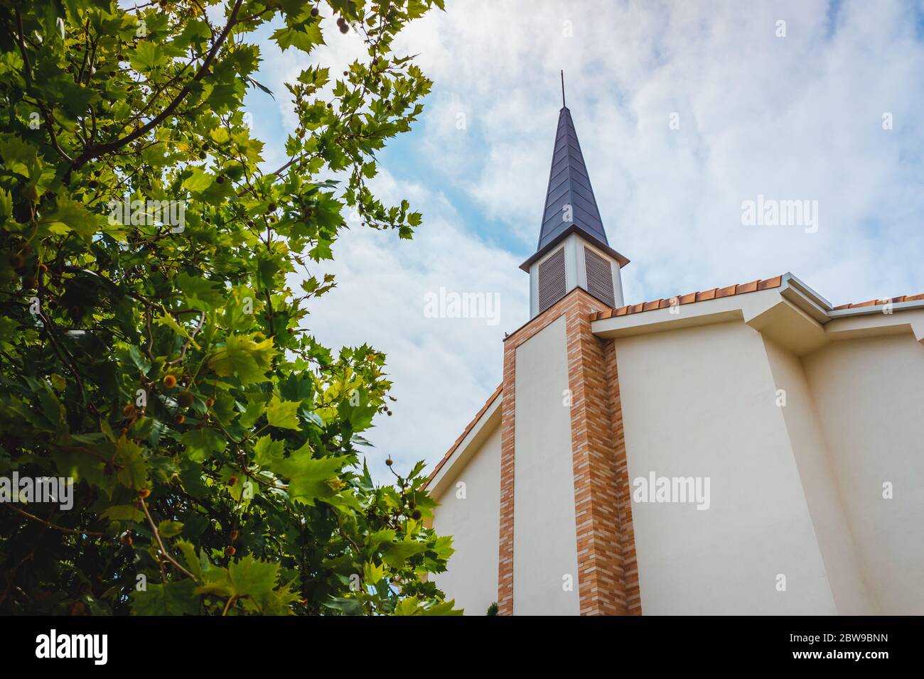 Building facade of a traditional American Protestant church with clock ...