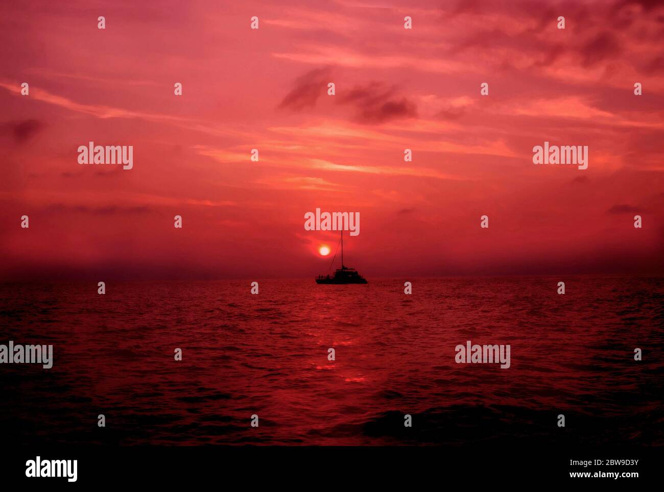 Lone boat on water sunset hi-res stock photography and images - Alamy
