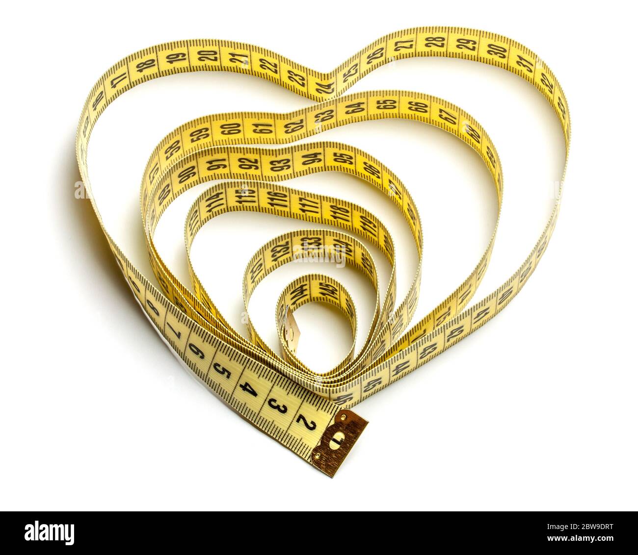 Heart made of yellow measuring tape isolated on a white background ...