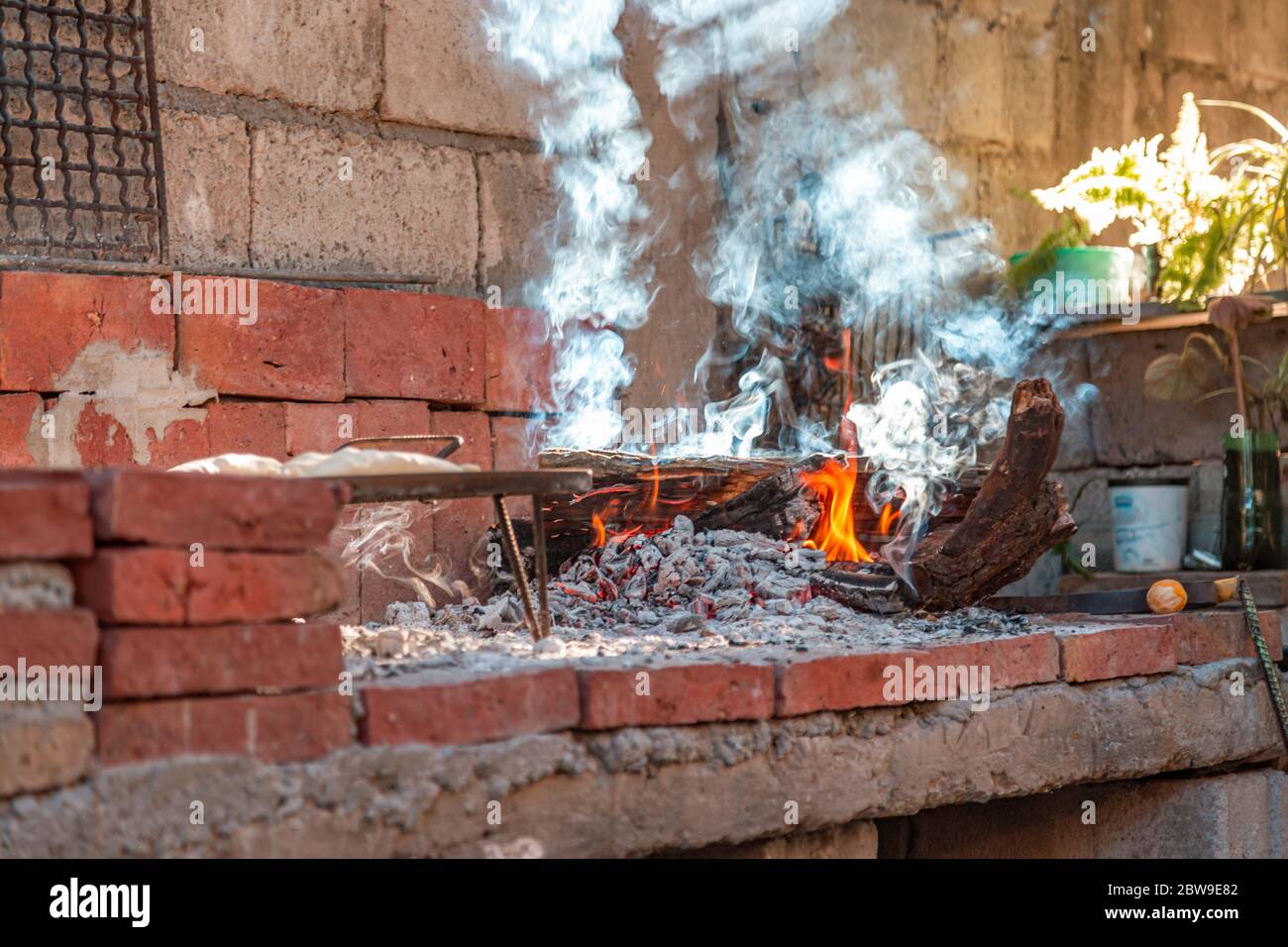 cooking on the grill with fire Stock Photo - Alamy