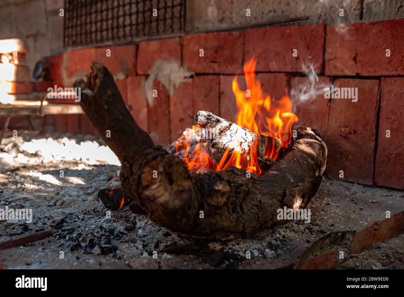 cooking on the grill with fire Stock Photo - Alamy
