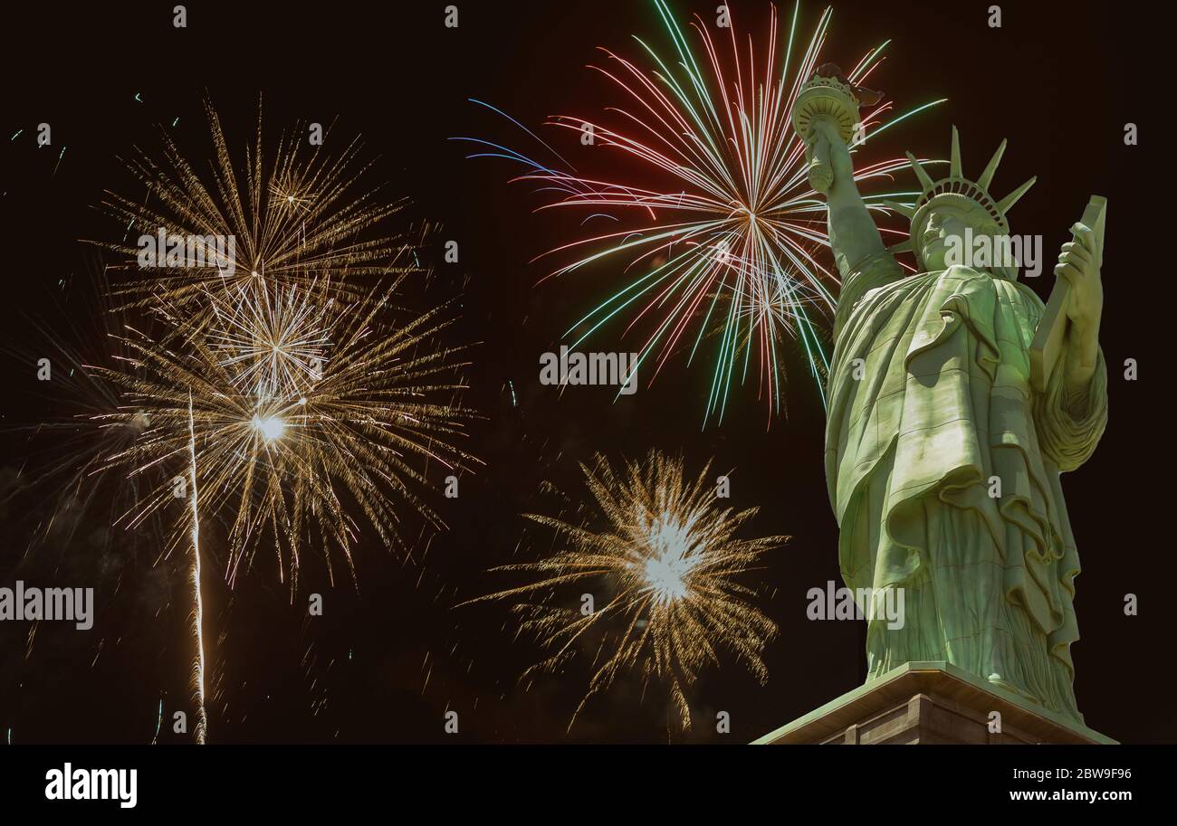 Cheerful beautiful colorful holiday fireworks on the American Statue of ...
