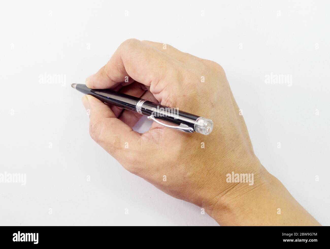 Men's hand holding Pen holder on the White Blackground Stock Photo - Alamy