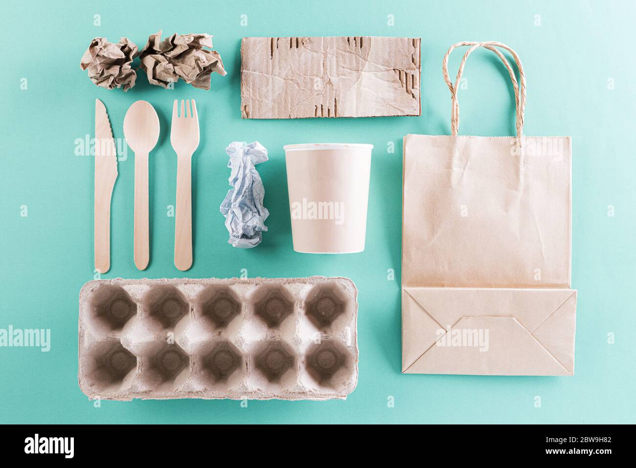 Top view of different paper garbage materials on green pastel ...