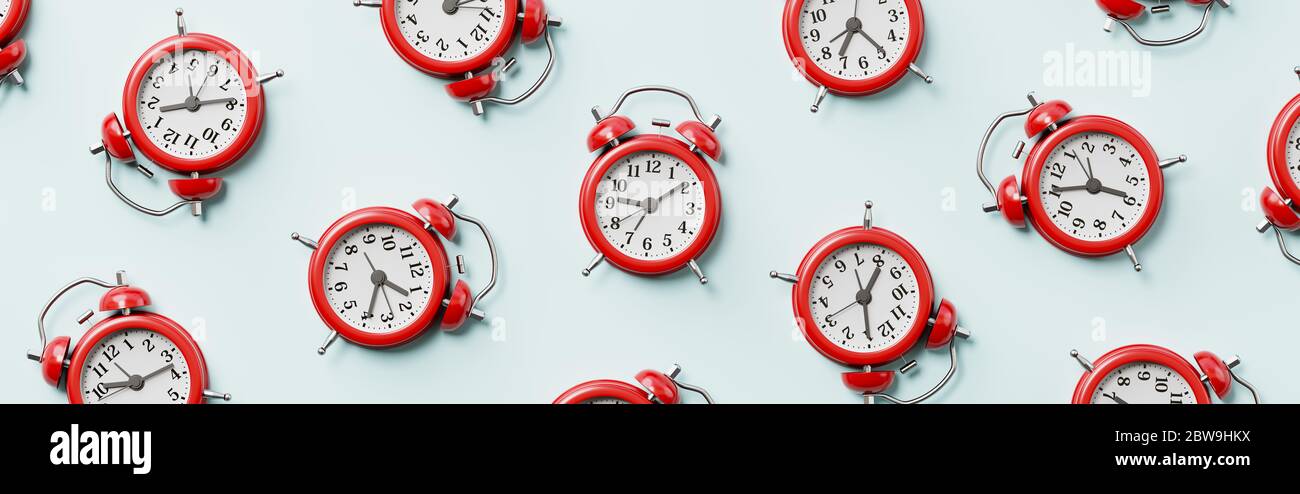 Red Alarm Clocks on Light Blue Background Stock Photo - Alamy