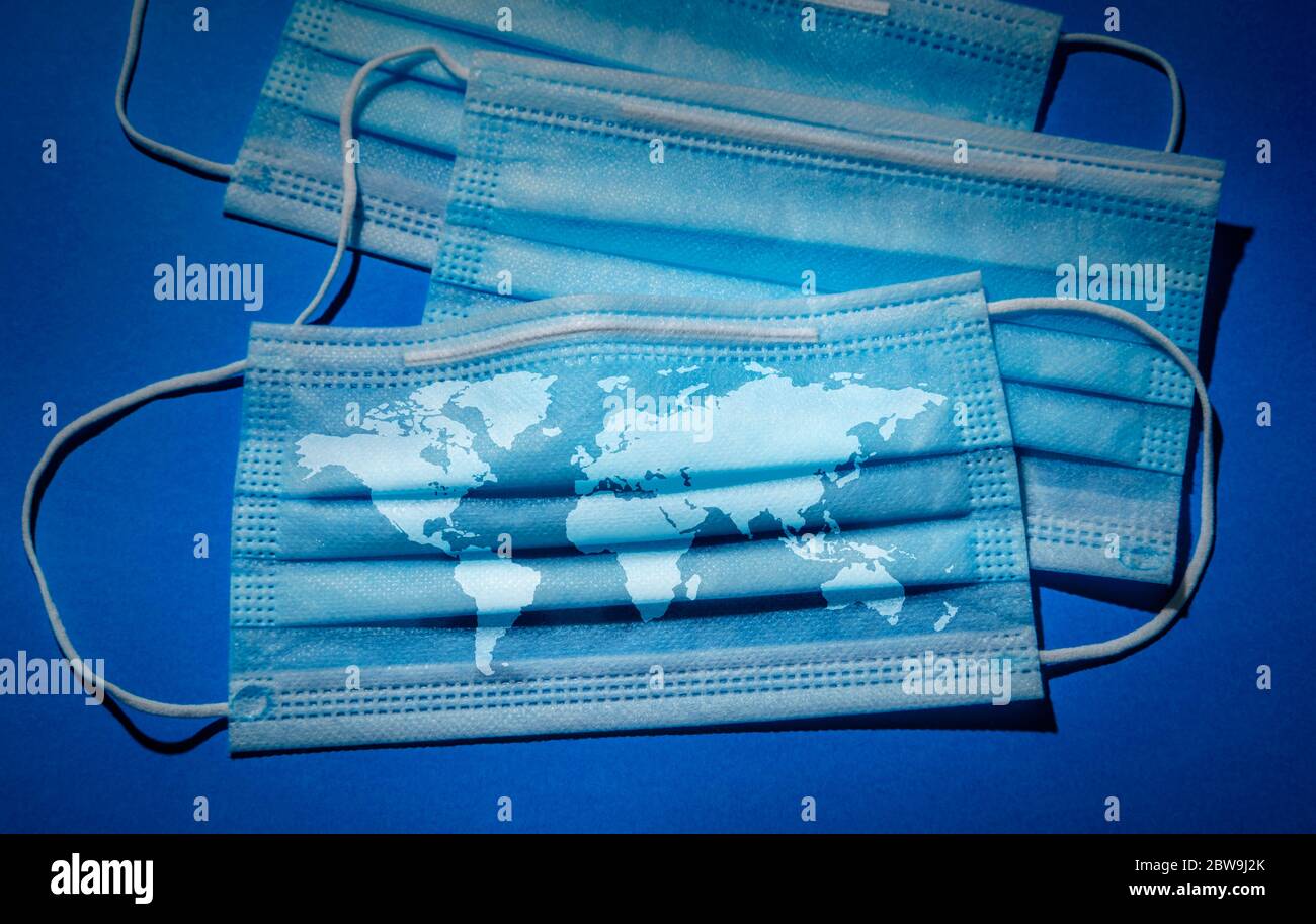 Studio shot of surgical masks with world map Stock Photo - Alamy