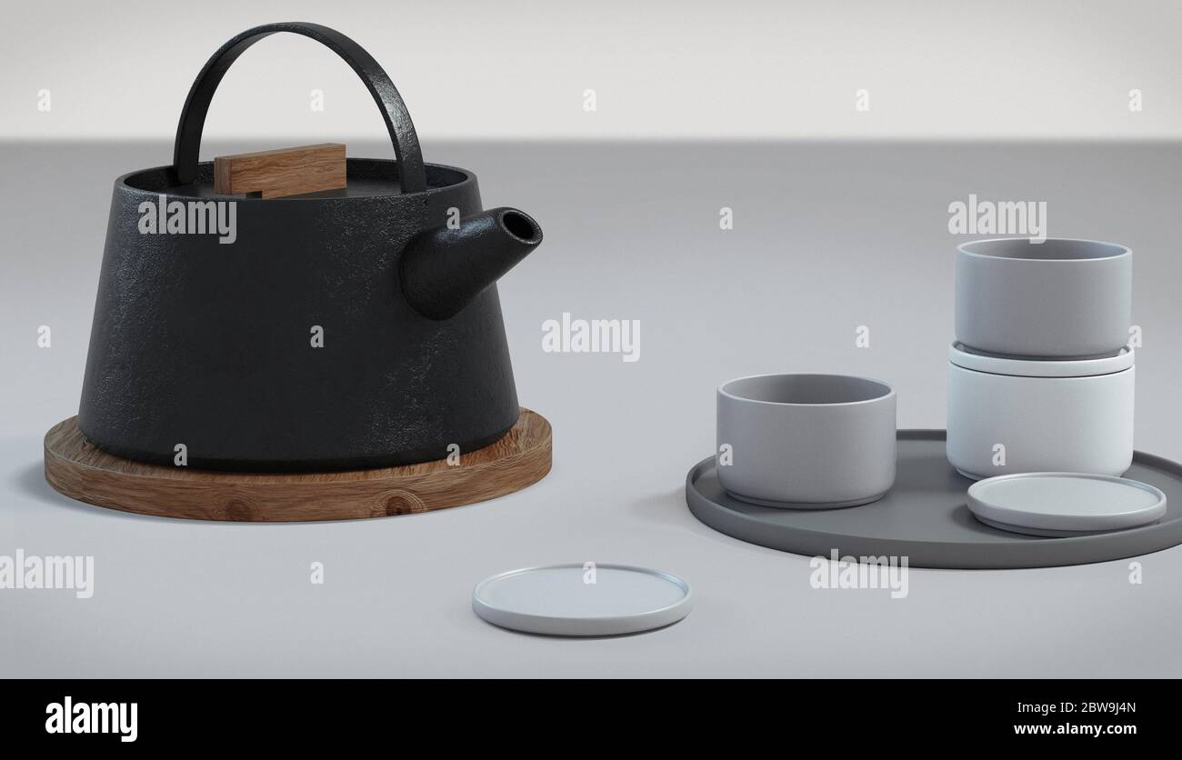 Modern black cast iron teapot and tea cups and a minimalist table white ...